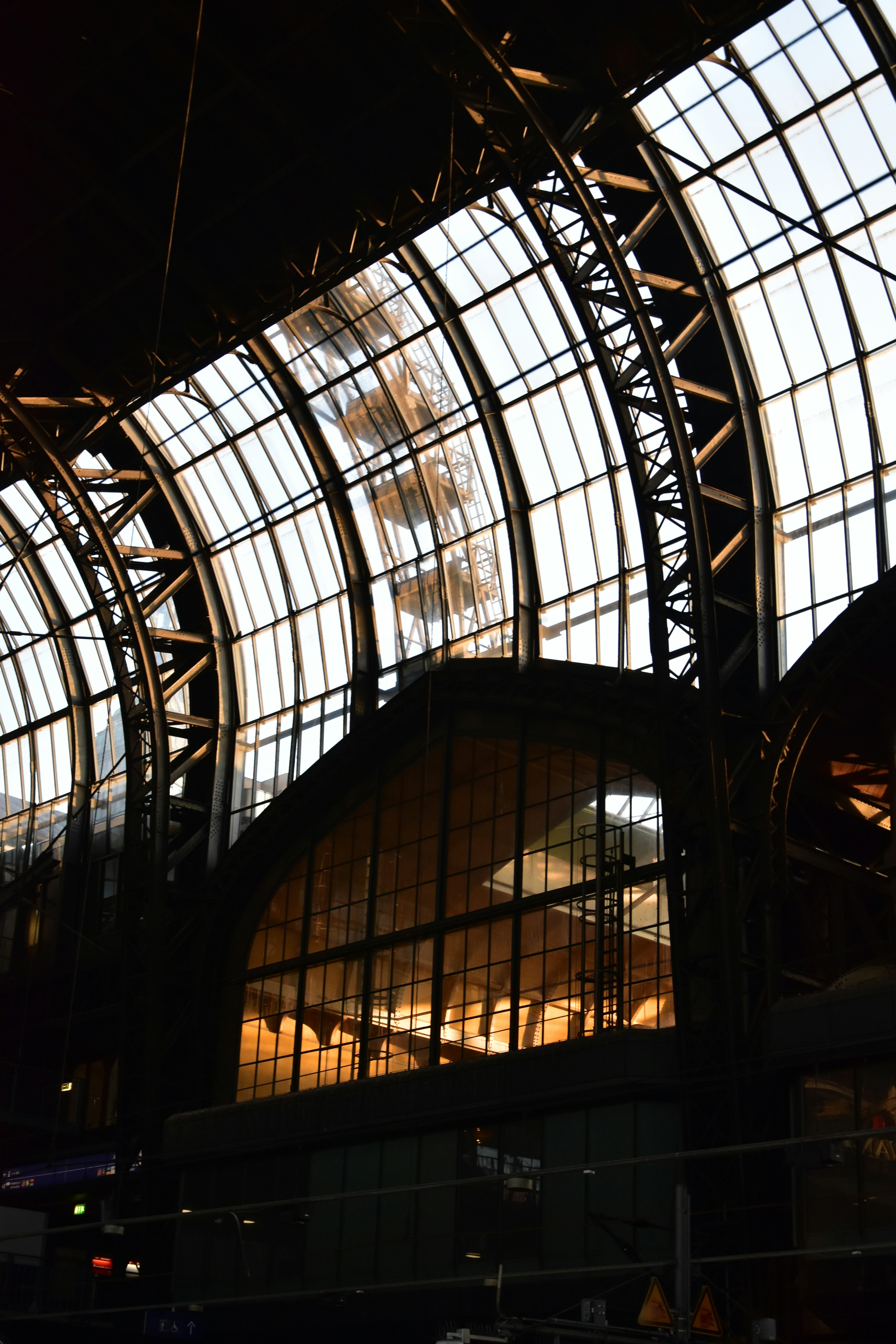 Industrial Elegance: Sunlight Through Arched Steel