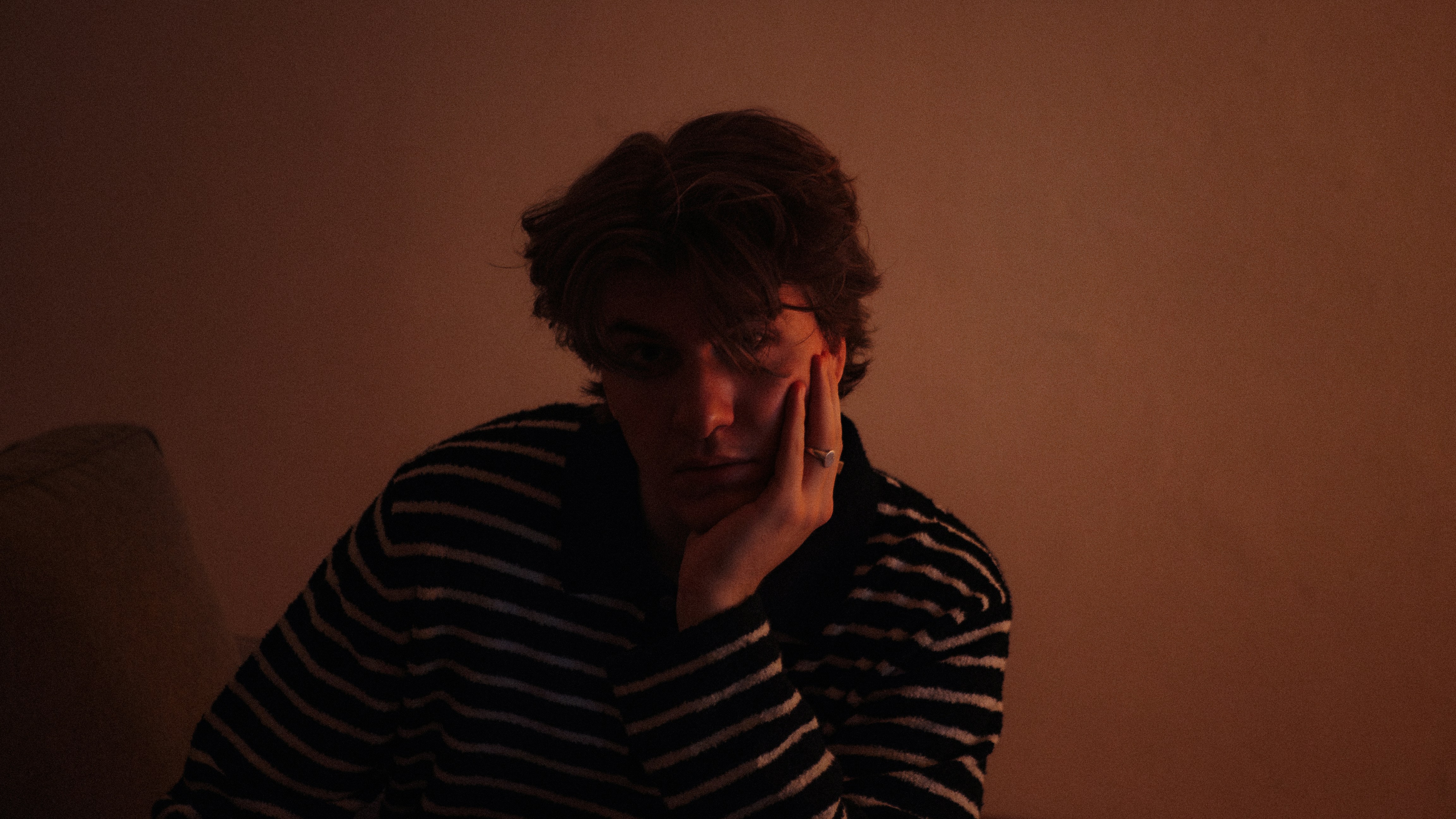 A person looking forlorn, illuminated by dim light. photo – Free ...