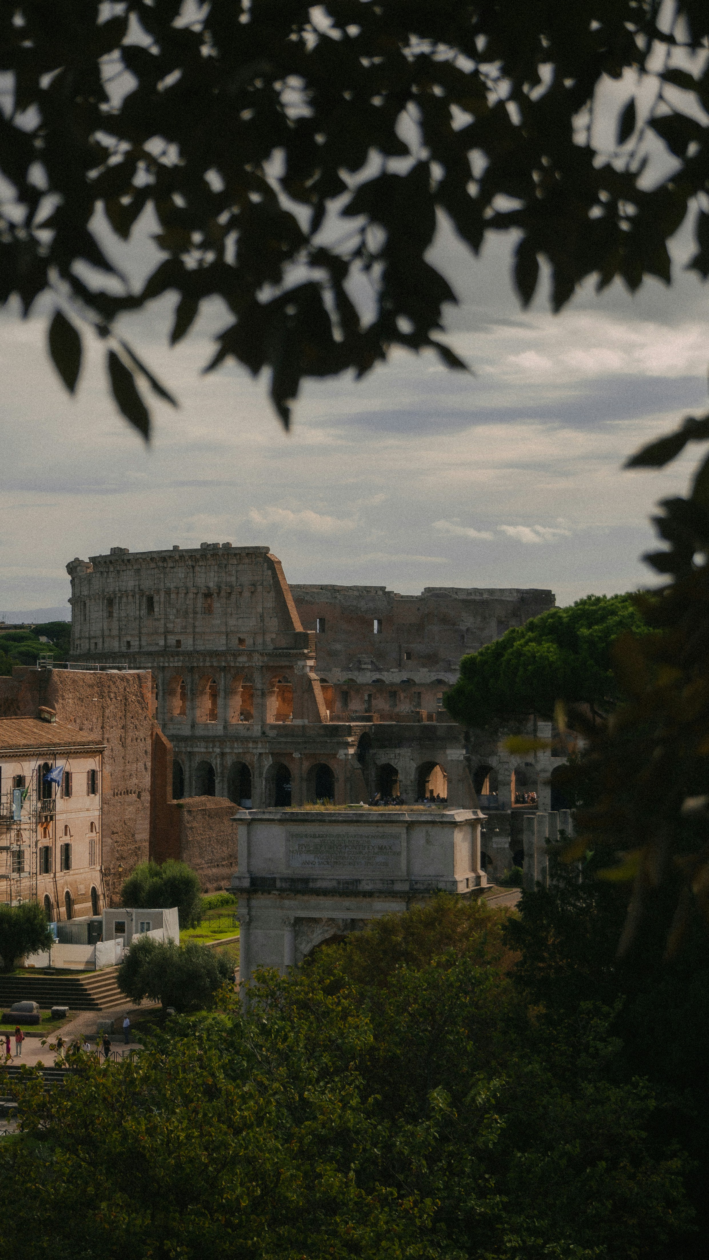 The colosseum in rome, italy, through the trees. photo – Free Rome ...