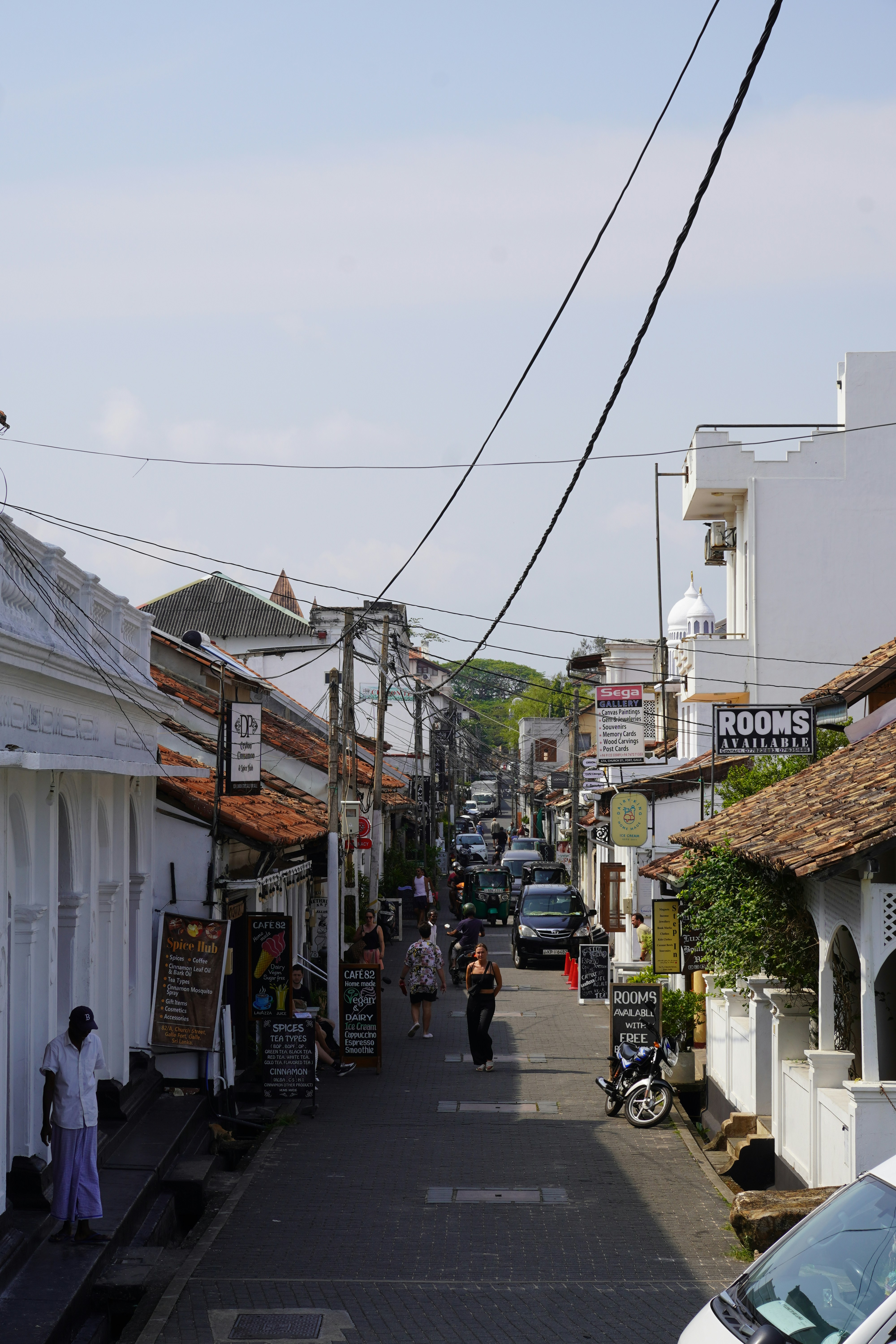 Street view of a quaint town with shops and people. photo – Free Car ...