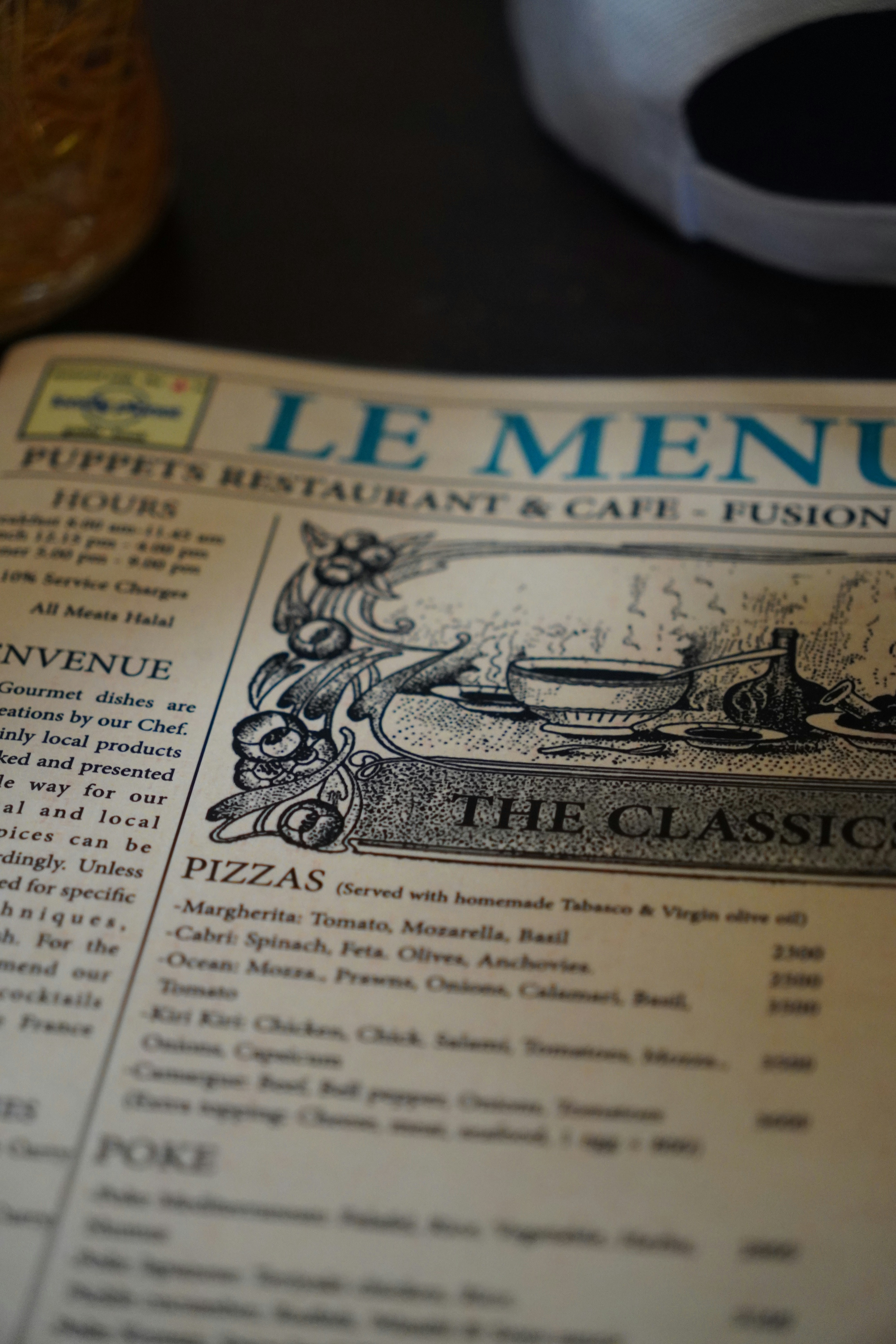 A restaurant's menu offers pizzas and pokes.