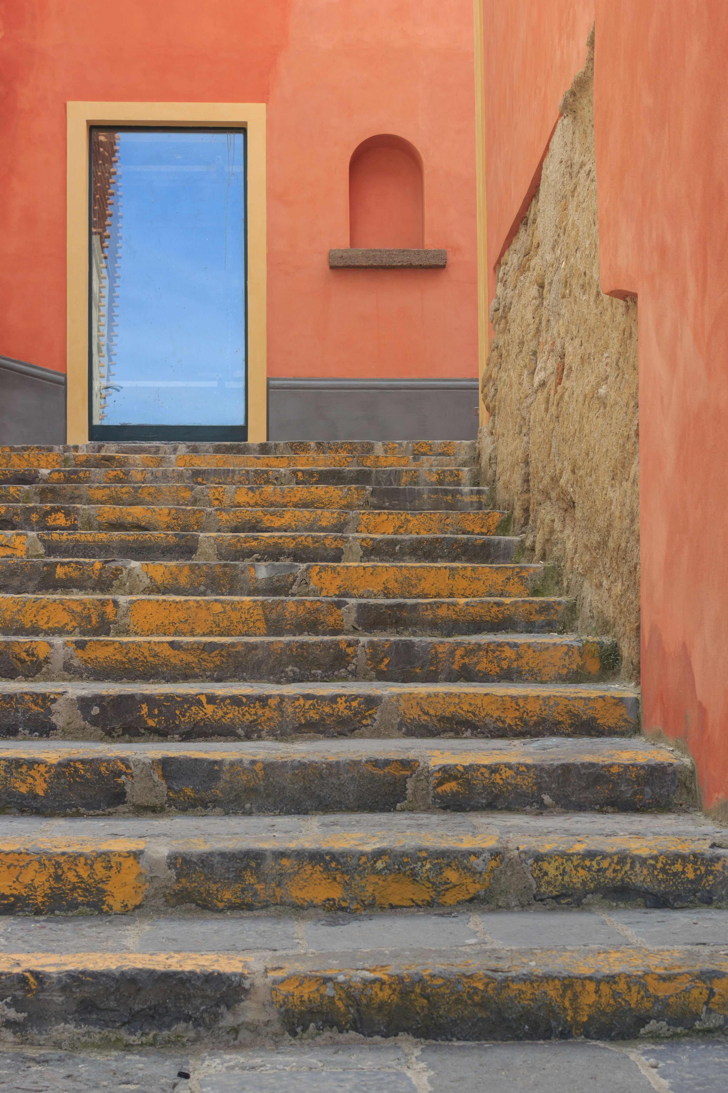 Stone steps lead to a window with sky reflection. photo – Free Building ...