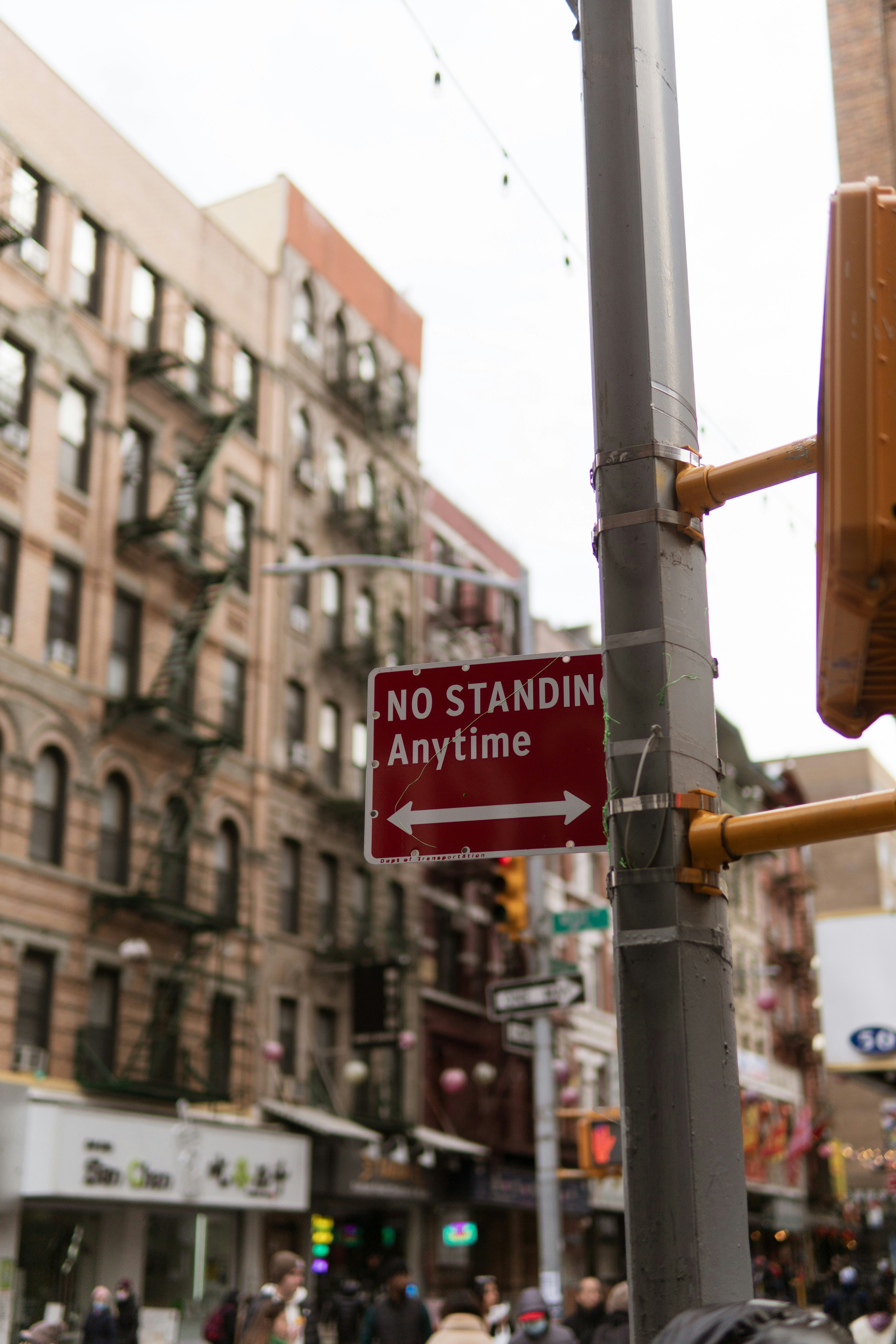 A "no standing" sign is posted on a city street. photo – Free New york ...