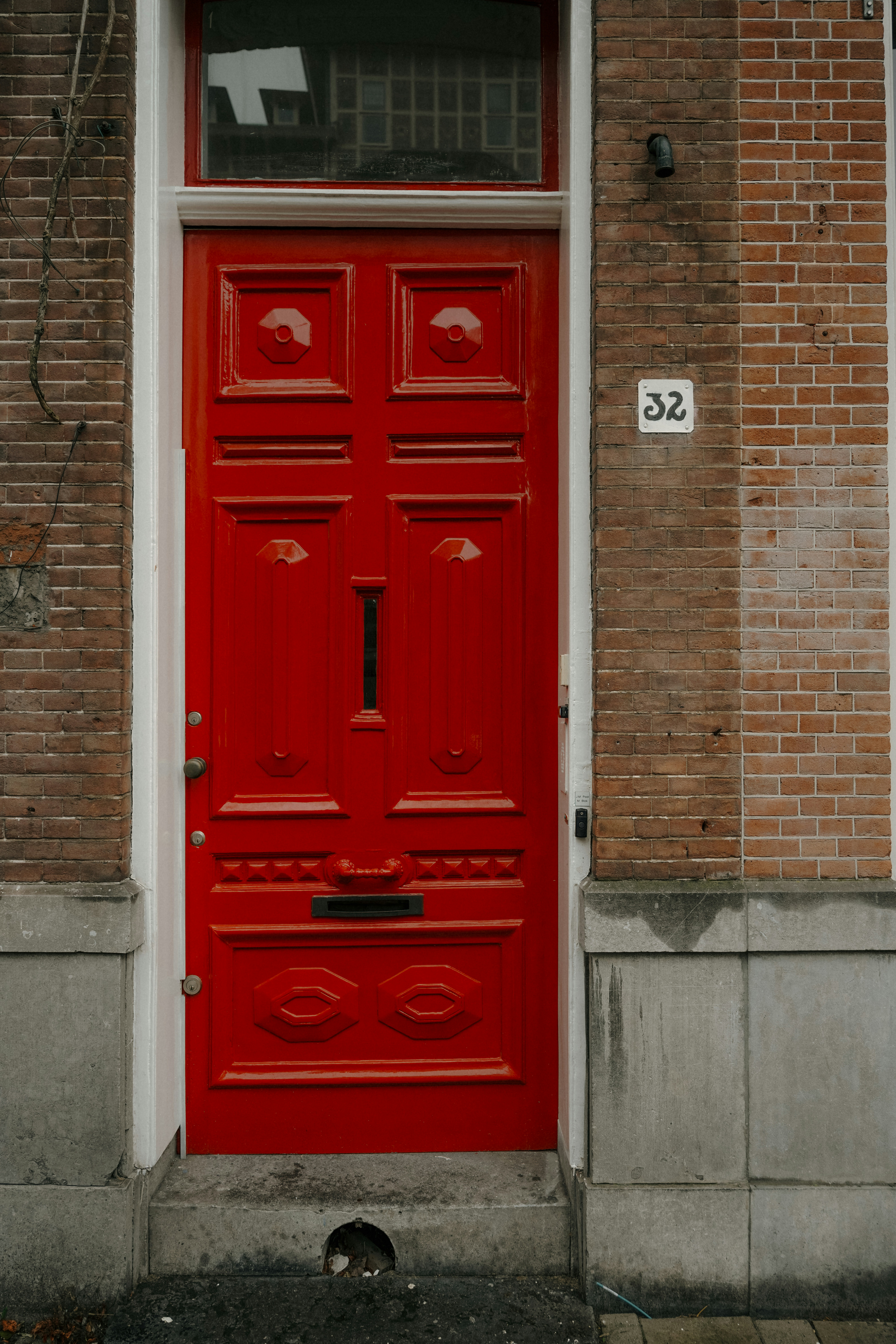 Scarlet Threshold in Urban Brickwork