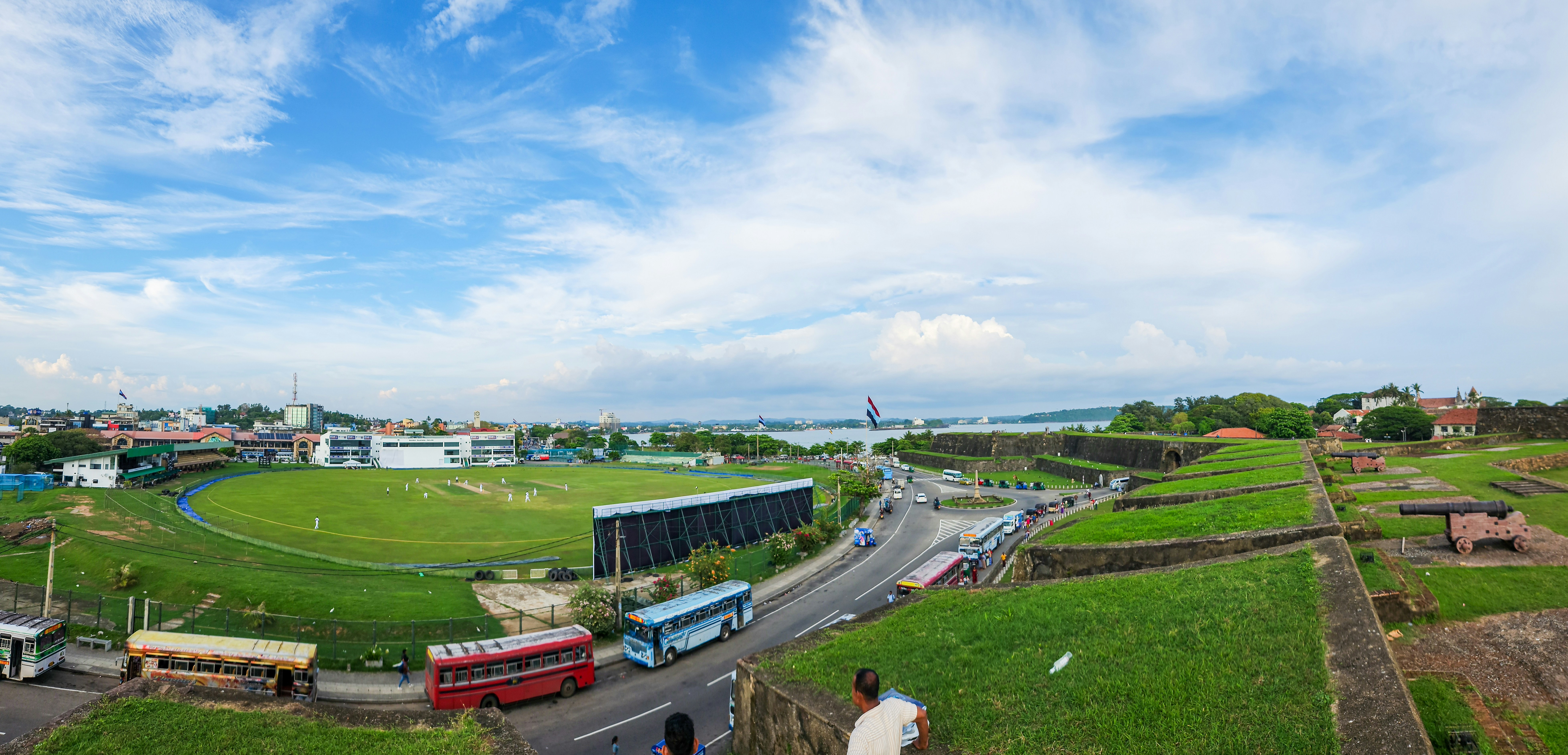 The best view of Galle International Stadium is from the historic Galle Fort ramparts in Sri Lanka. It is considered to be one of the most picturesque cricket grounds in the world. The ground was built in 1876 as a race course. There was no permanent pavilion until 1892, when a 'grand stand' was built according to a suggestion of P. A. Templer, the then Secretary of the Galle Municipal Council. Eventually the racing ceased and the ground was used for cricket matches more than races.