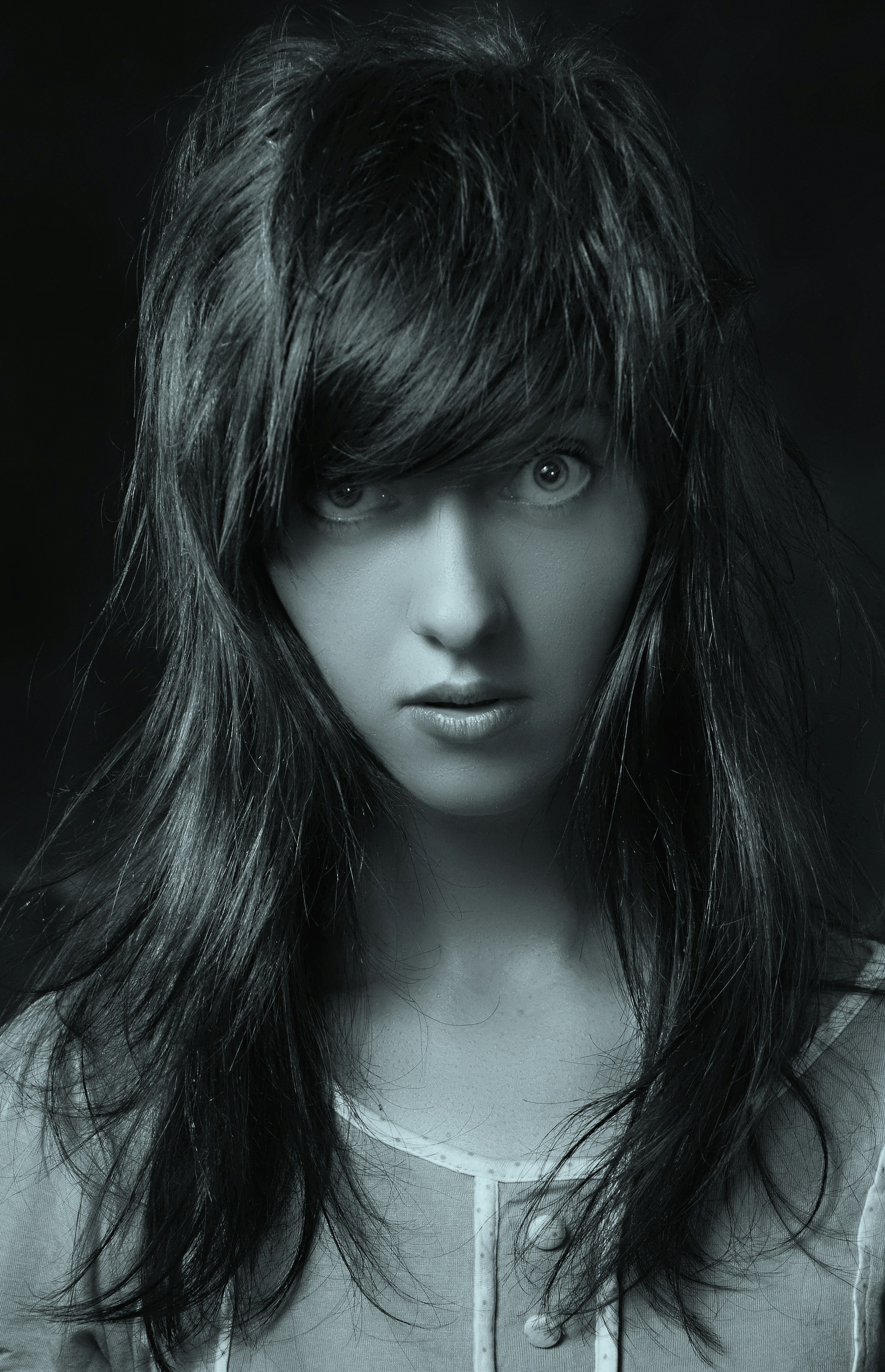A woman with long hair stares intently. photo – Free Portrait Image on ...