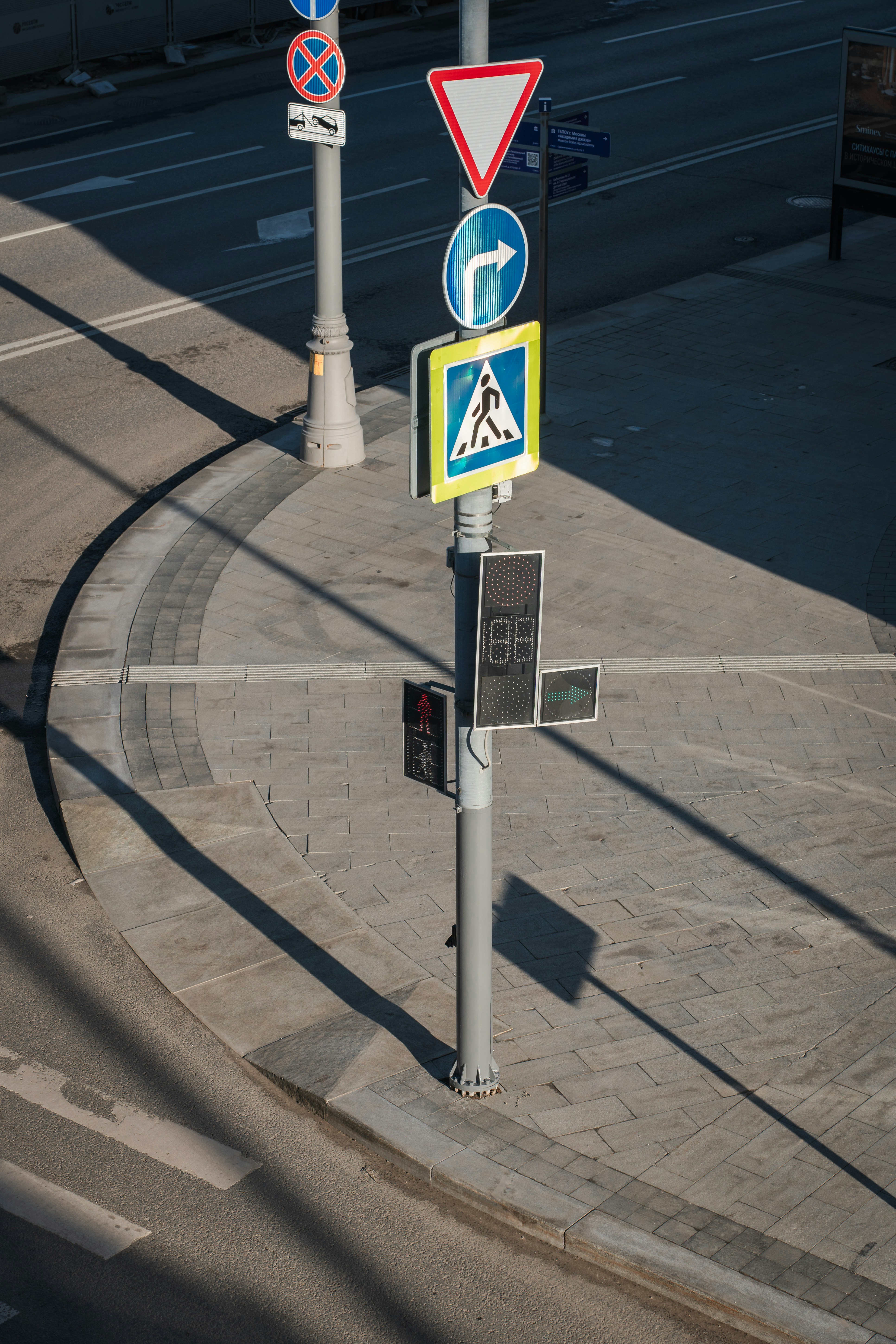 Traffic signs and signals line a street. photo – Free Urban Image on ...