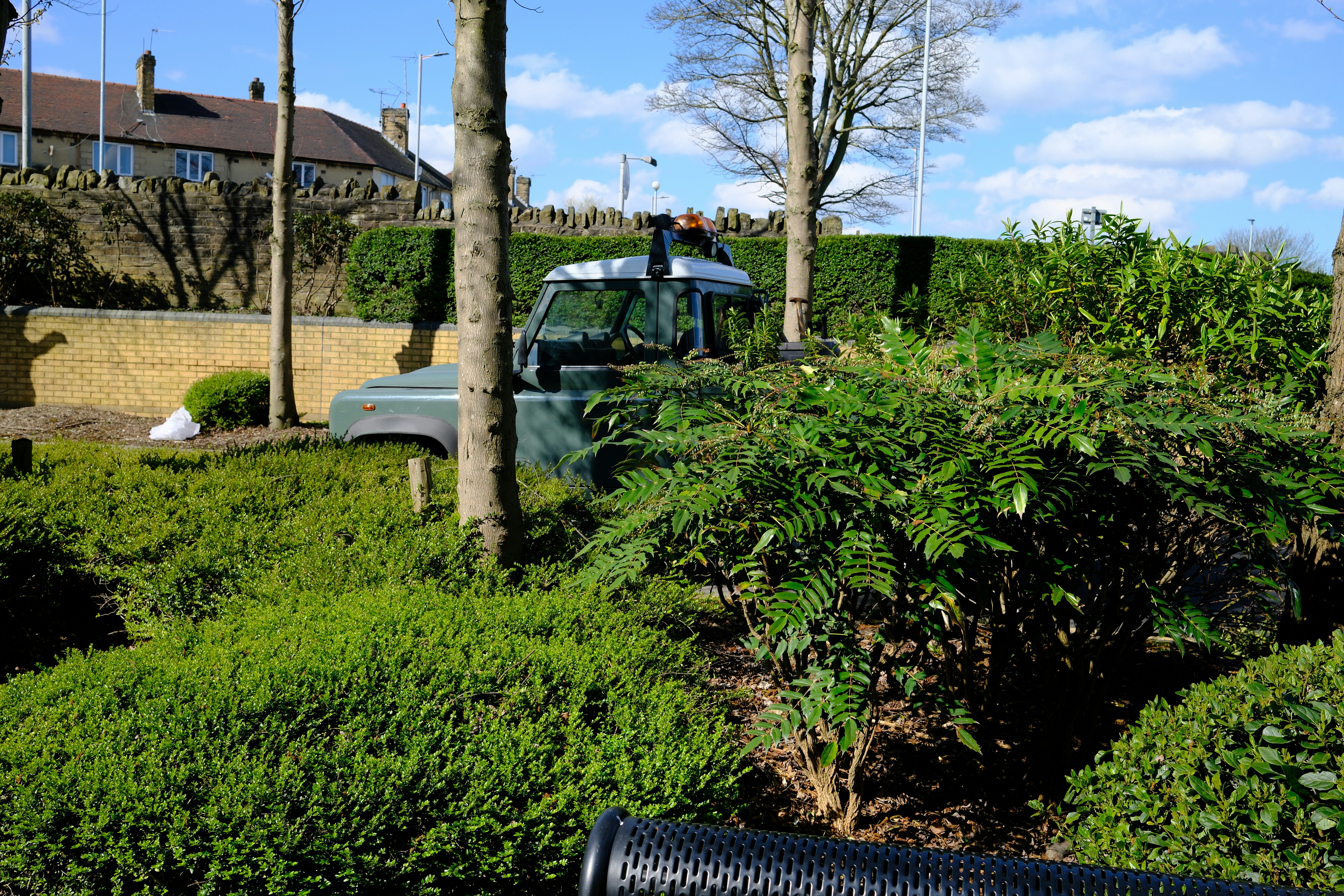 A green land rover is parked amongst greenery. photo – Free Car Image ...