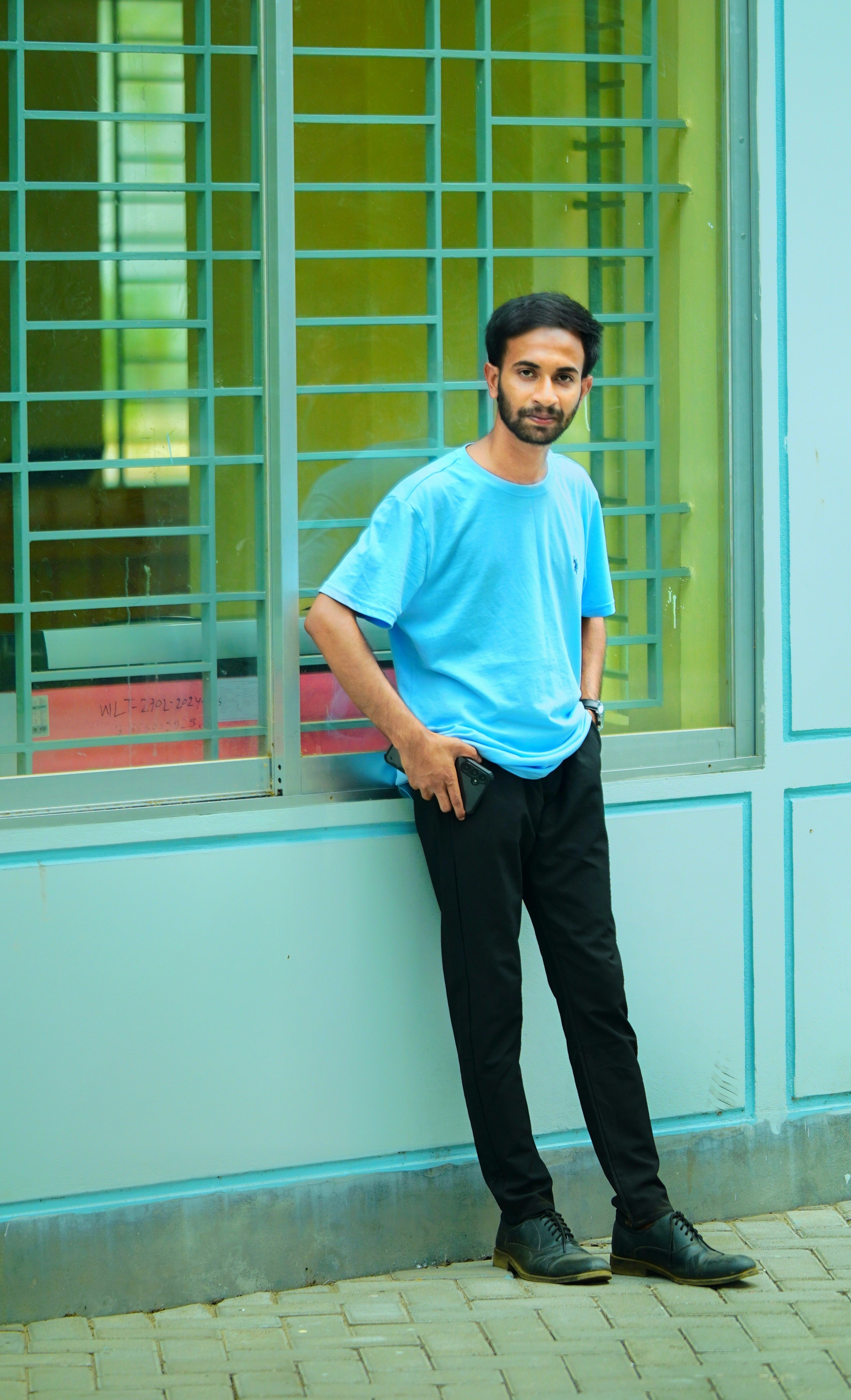 Apurbo chandra Bangladesh new look new style new poses new fashion come back Bangladesh nmbr on handsome cute boys wallpaper photos free download photos @apurbochandra | A man is leaning against a building.