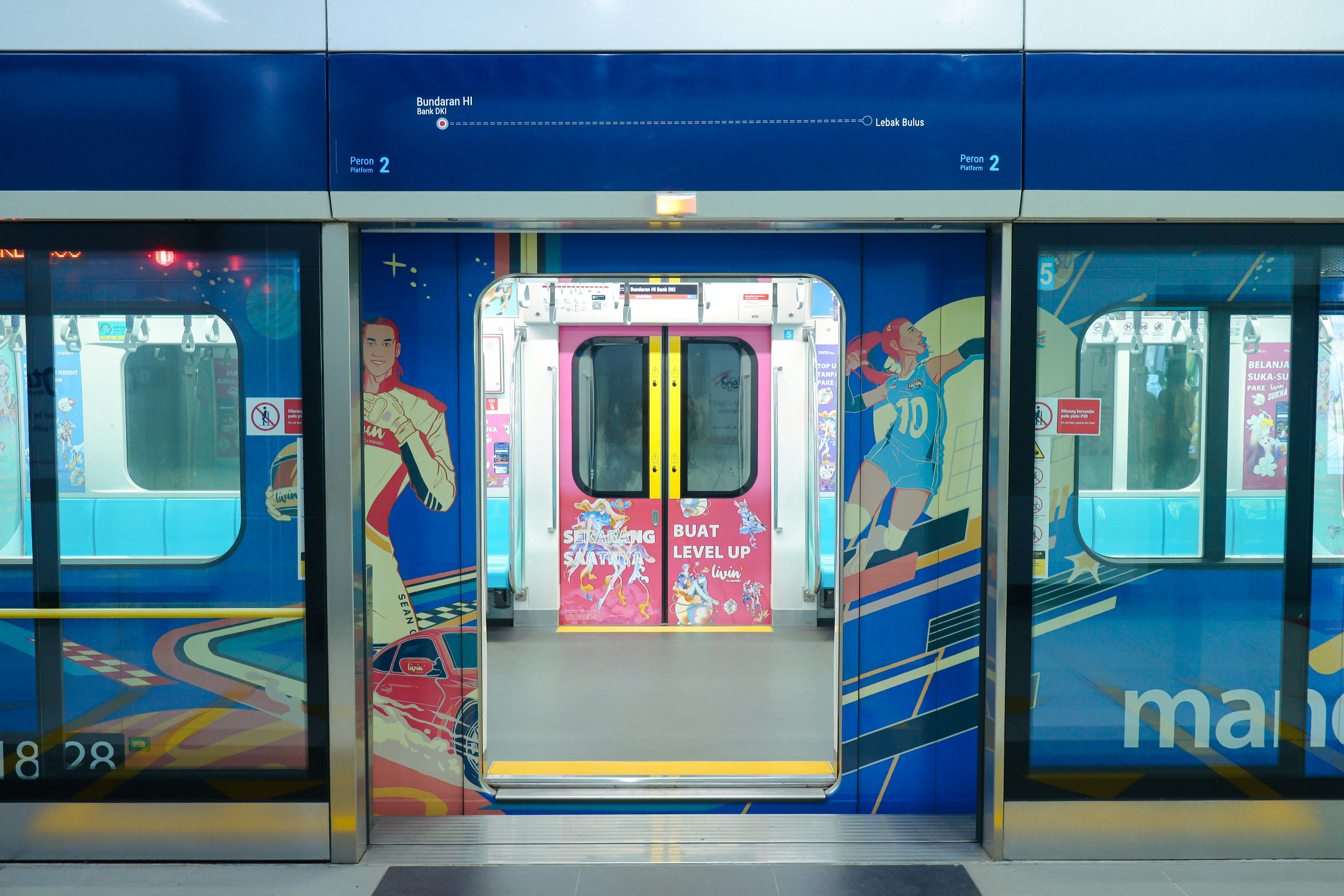 Subway doors with vibrant sports-themed decorations. photo – Free ...