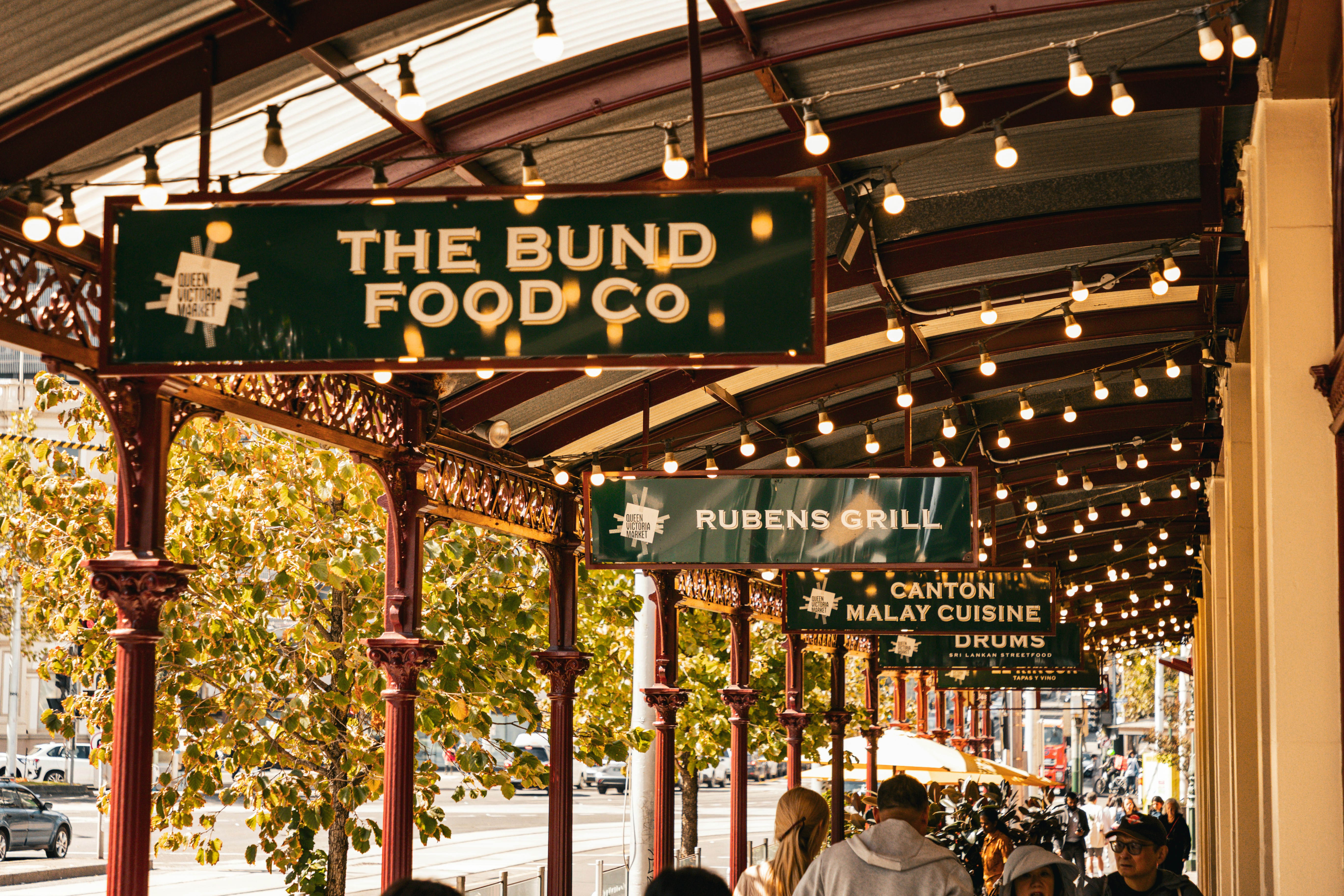 Signs indicate restaurants and food options. photo – Free Building ...