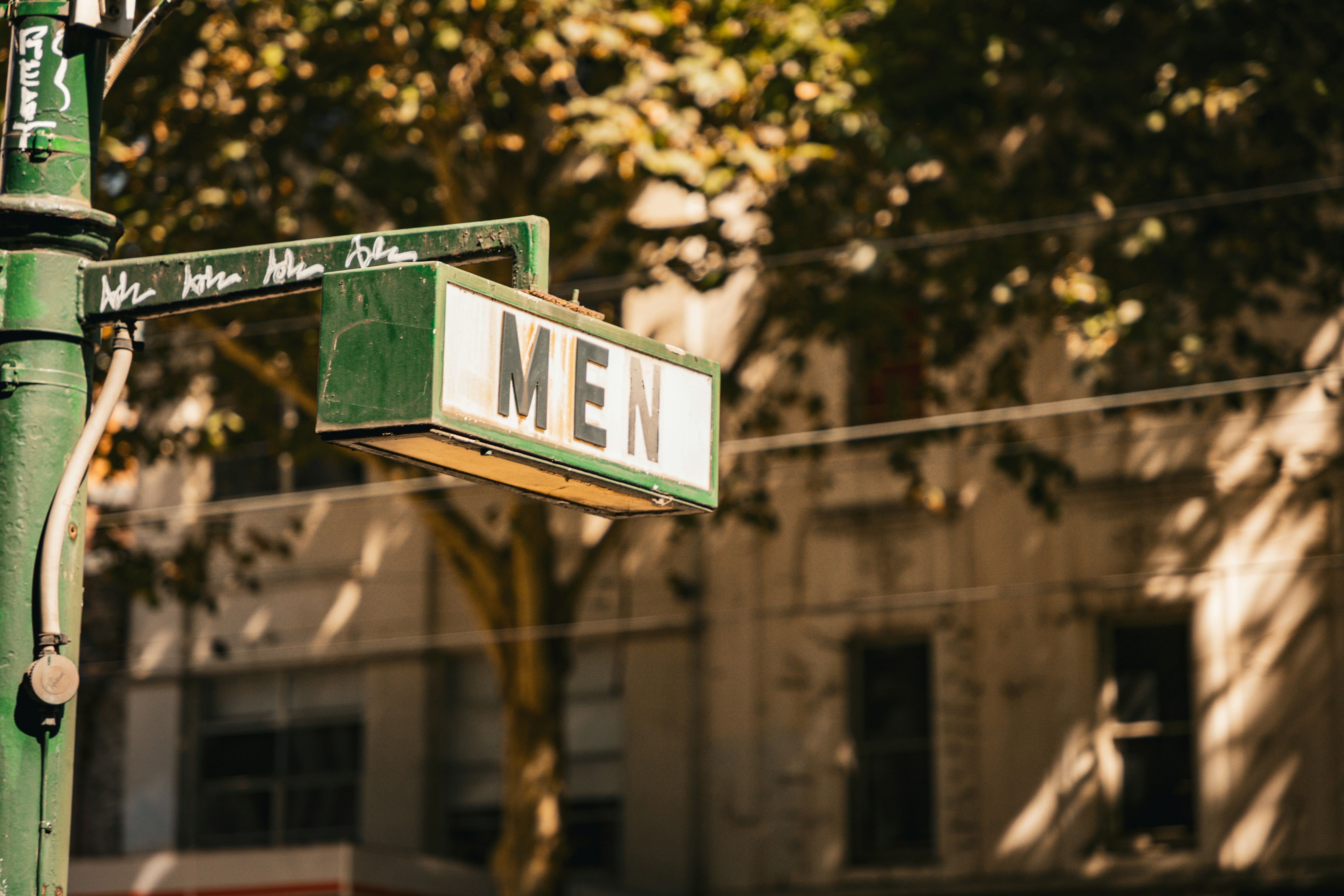 MEN Sign on a Green Pole: Quiet City Light