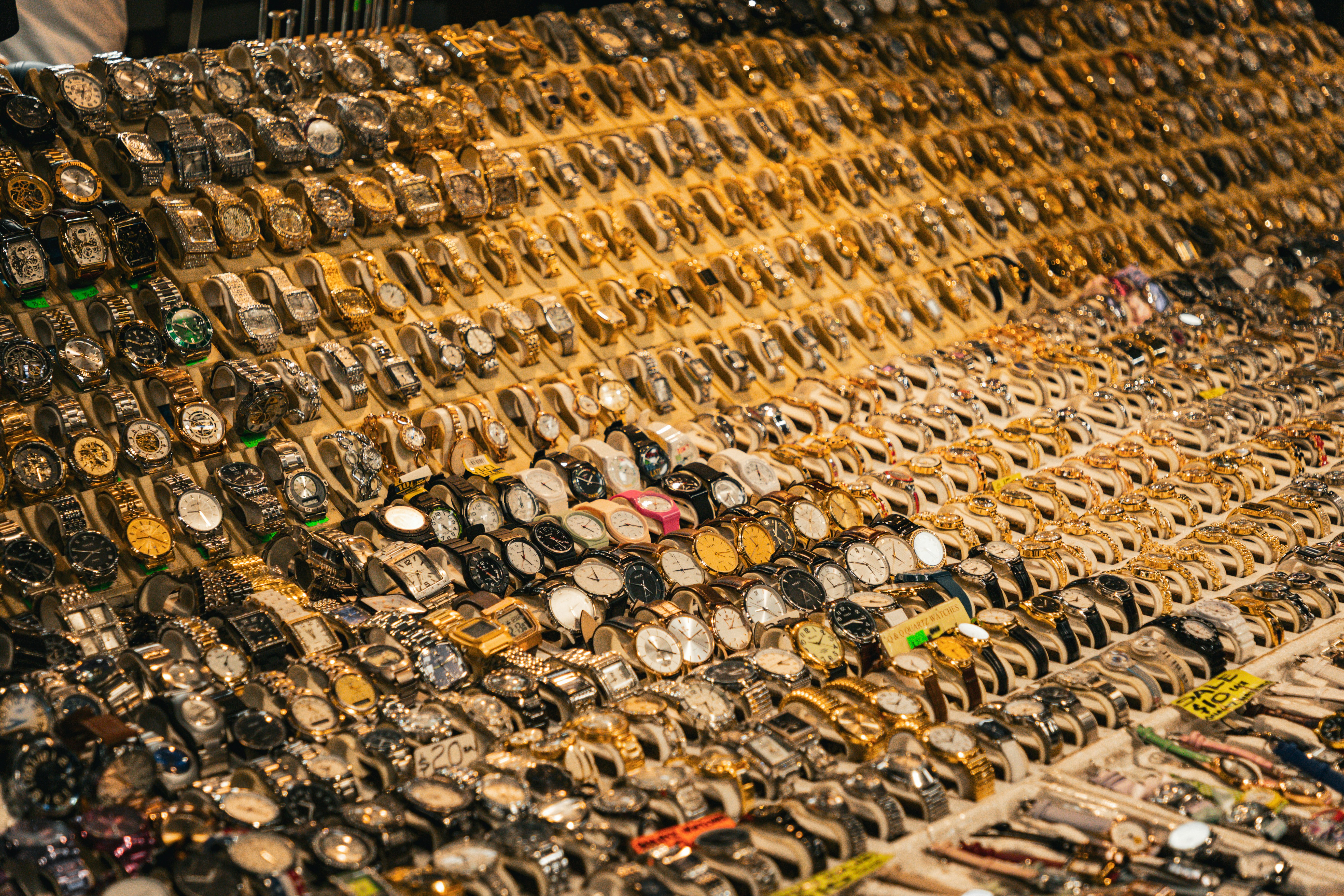 Rows of Time: A Dense Tapestry of Wristwatches on Display Shelves
