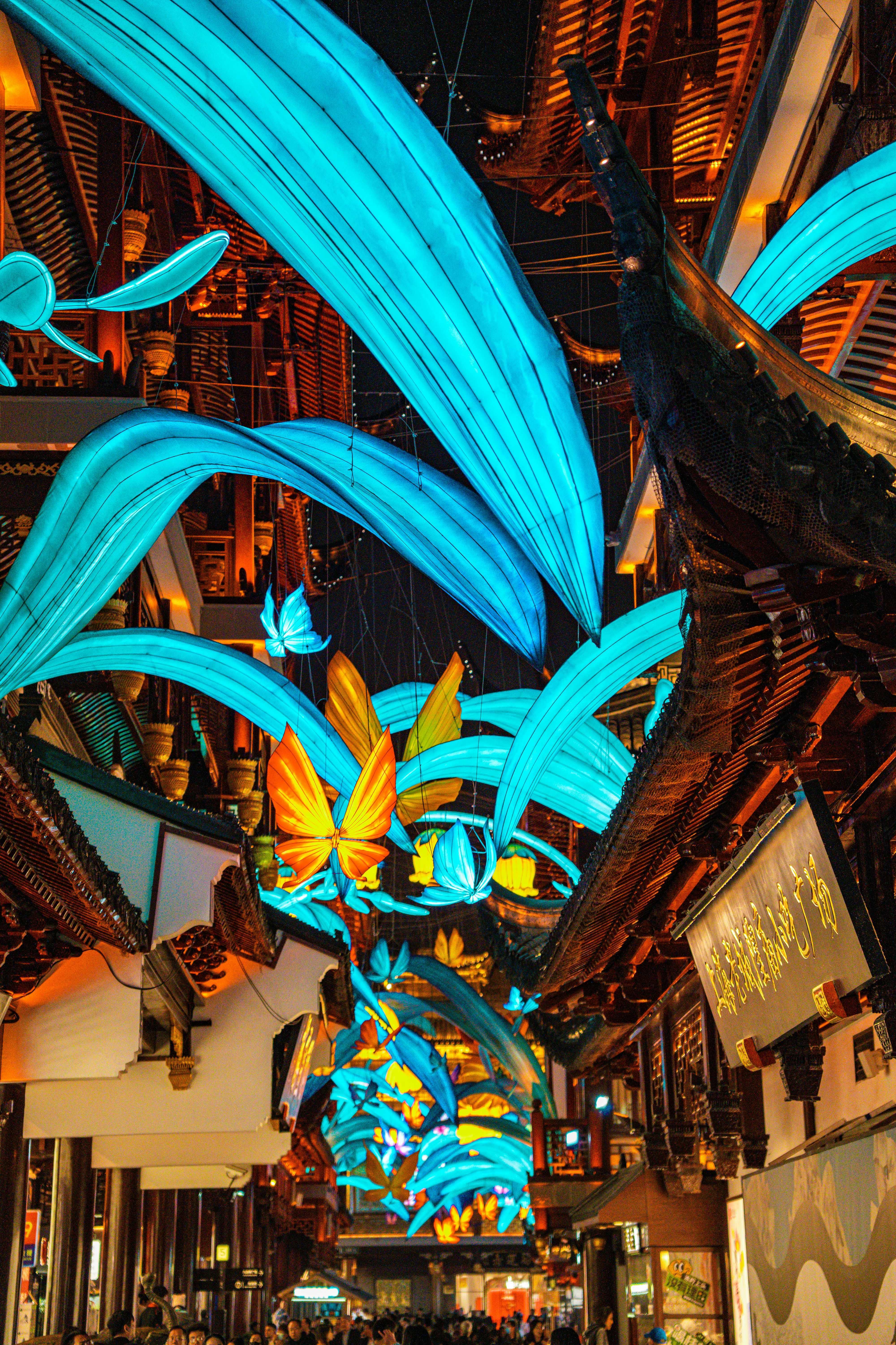 Neon Lotus Alley: Turquoise Petals Draped Over a Heritage Arcade