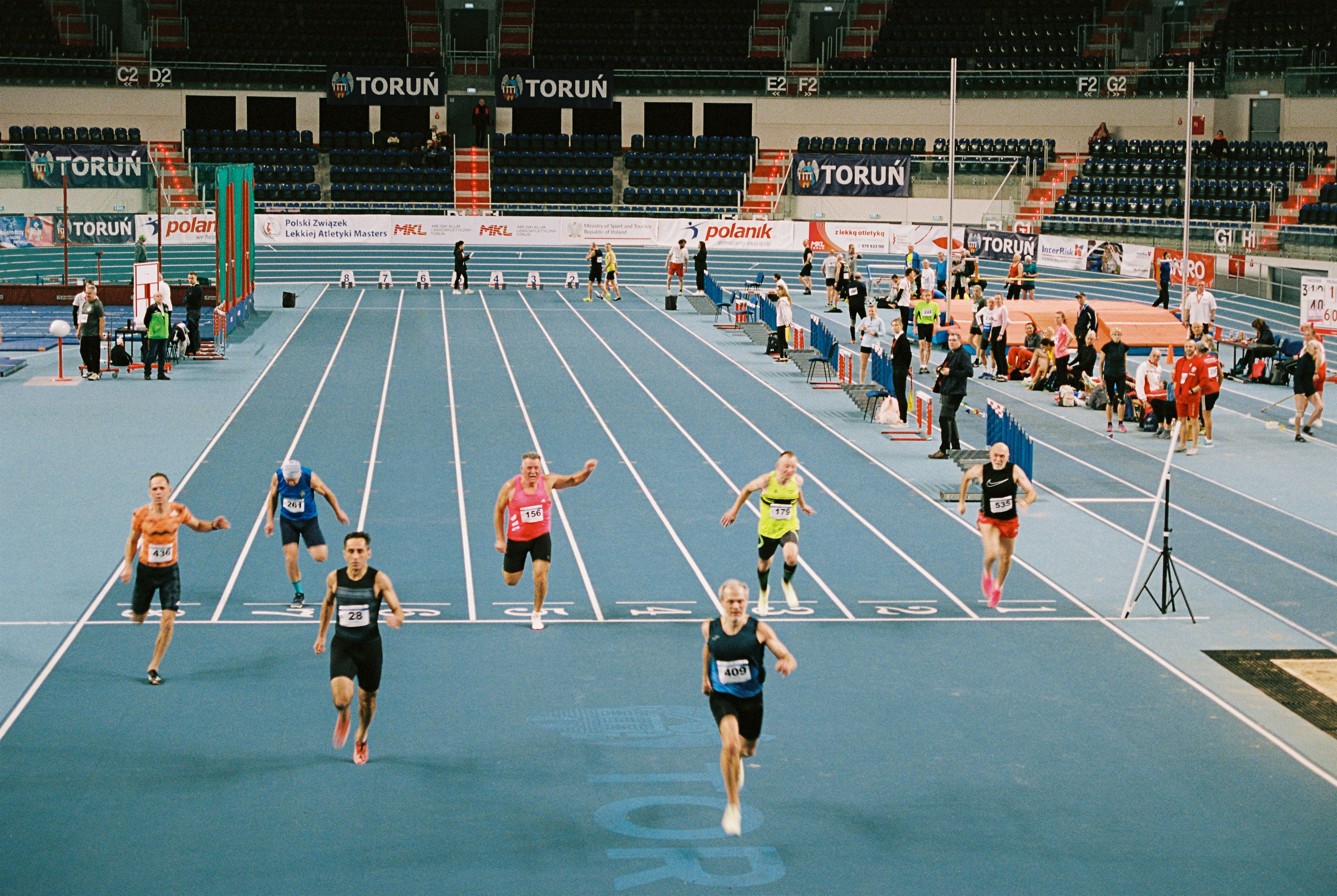 Runners compete in a track and field race. photo – Free Marathon Image ...