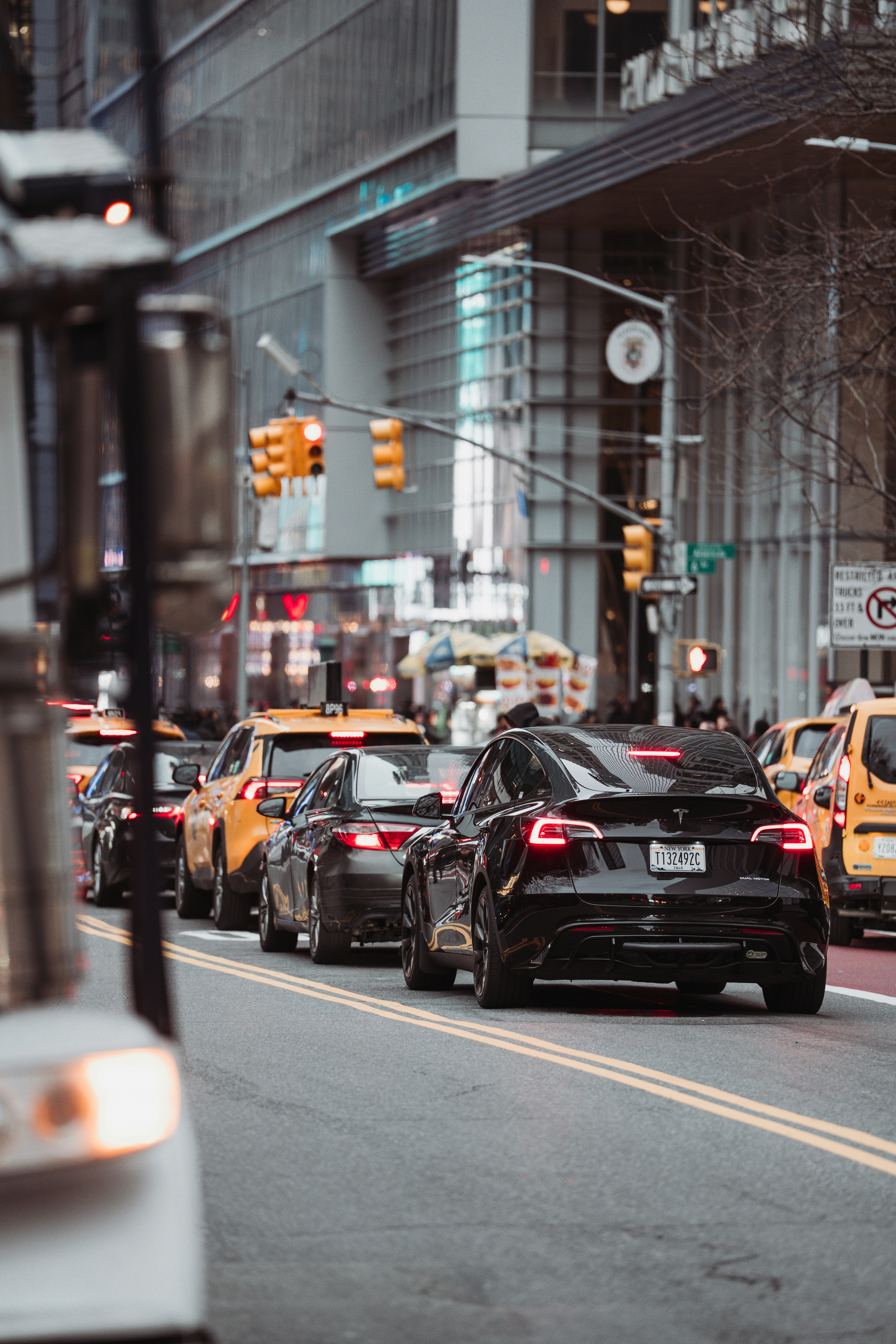 Traffic jam with yellow cabs and cars on a busy New York City street.