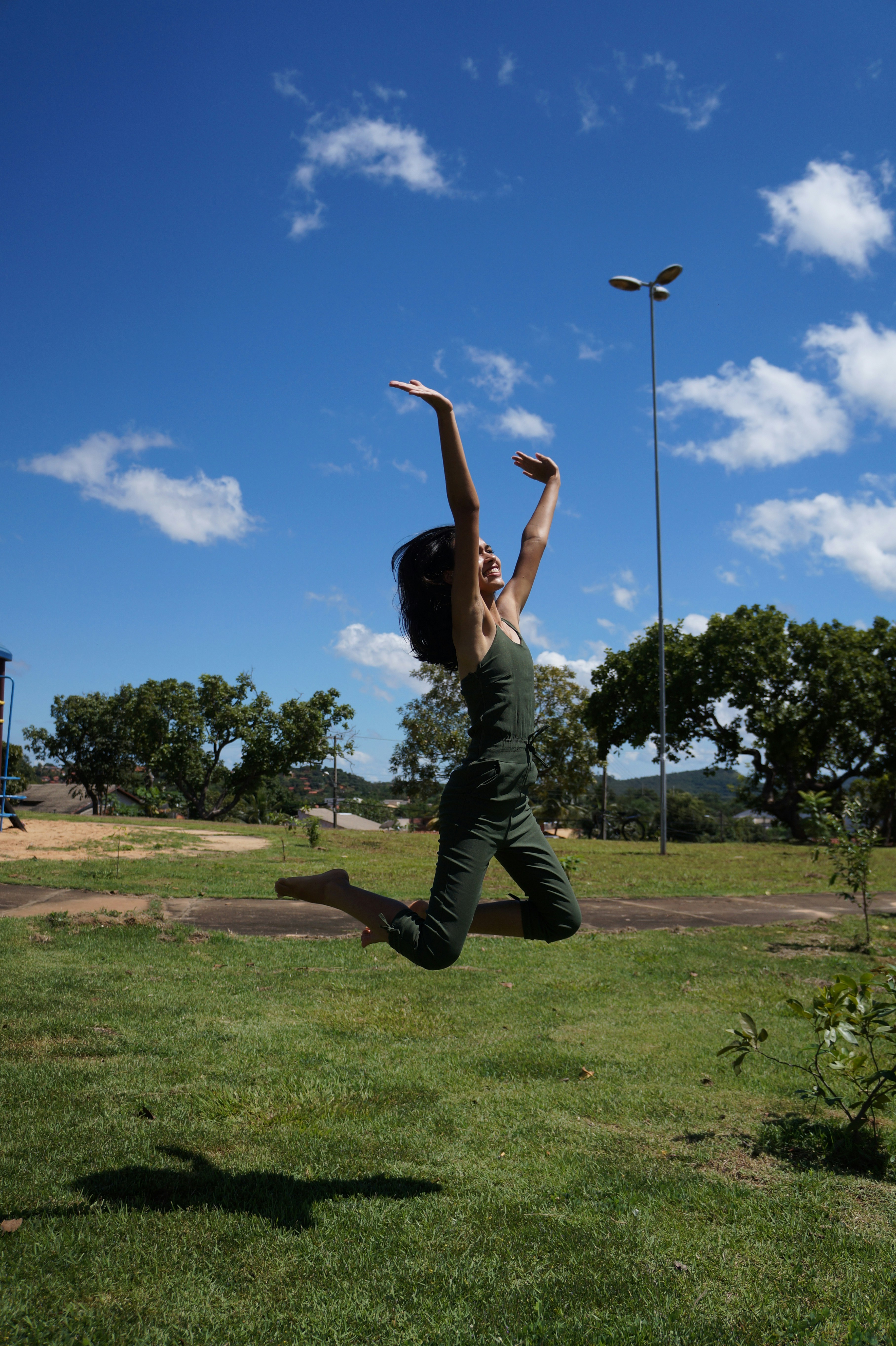 Joyful Leap Under a Clear Sky