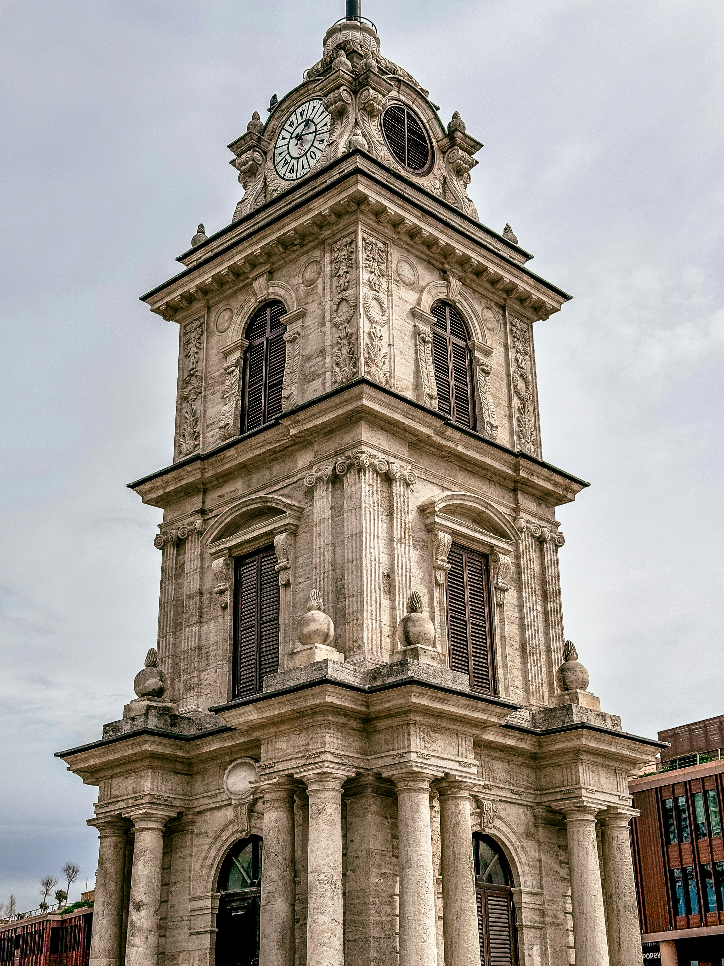 Stone Clocktower: Time's Carved Sentinel Reaching the Sky