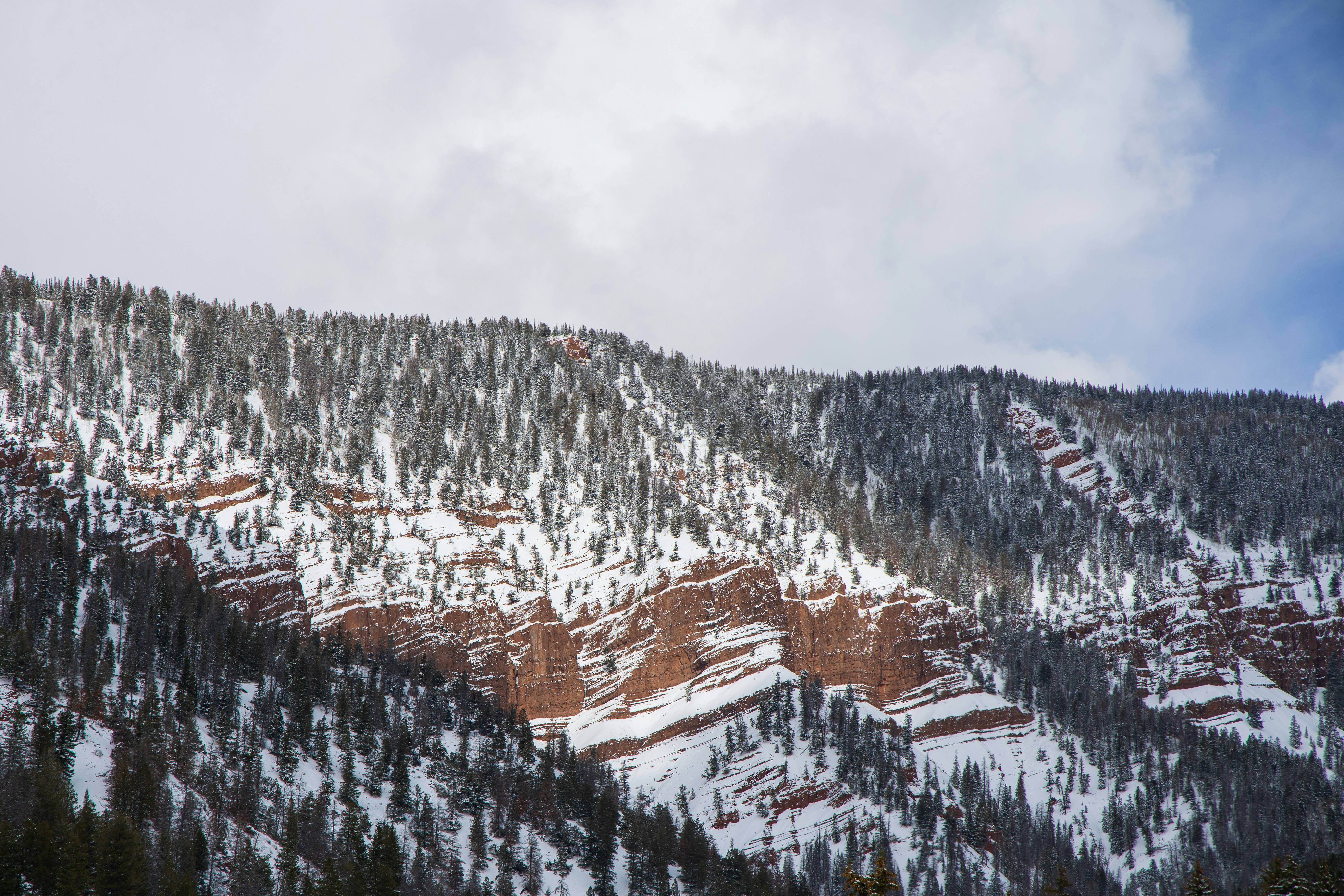 Snow-Kissed Ridges under a Breathing Sky