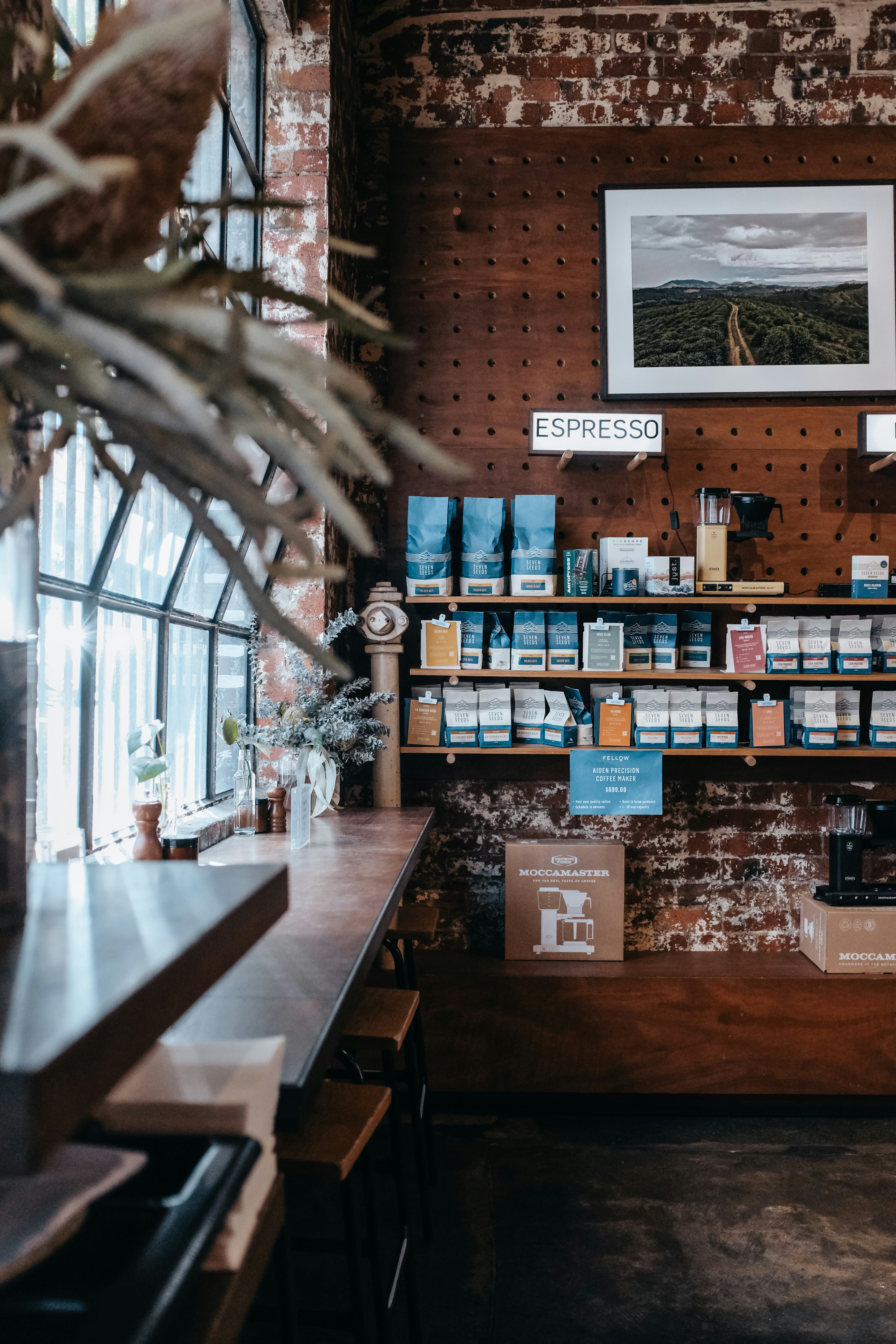 Cozy coffee shop interior with shelves of products. photo – Free ...