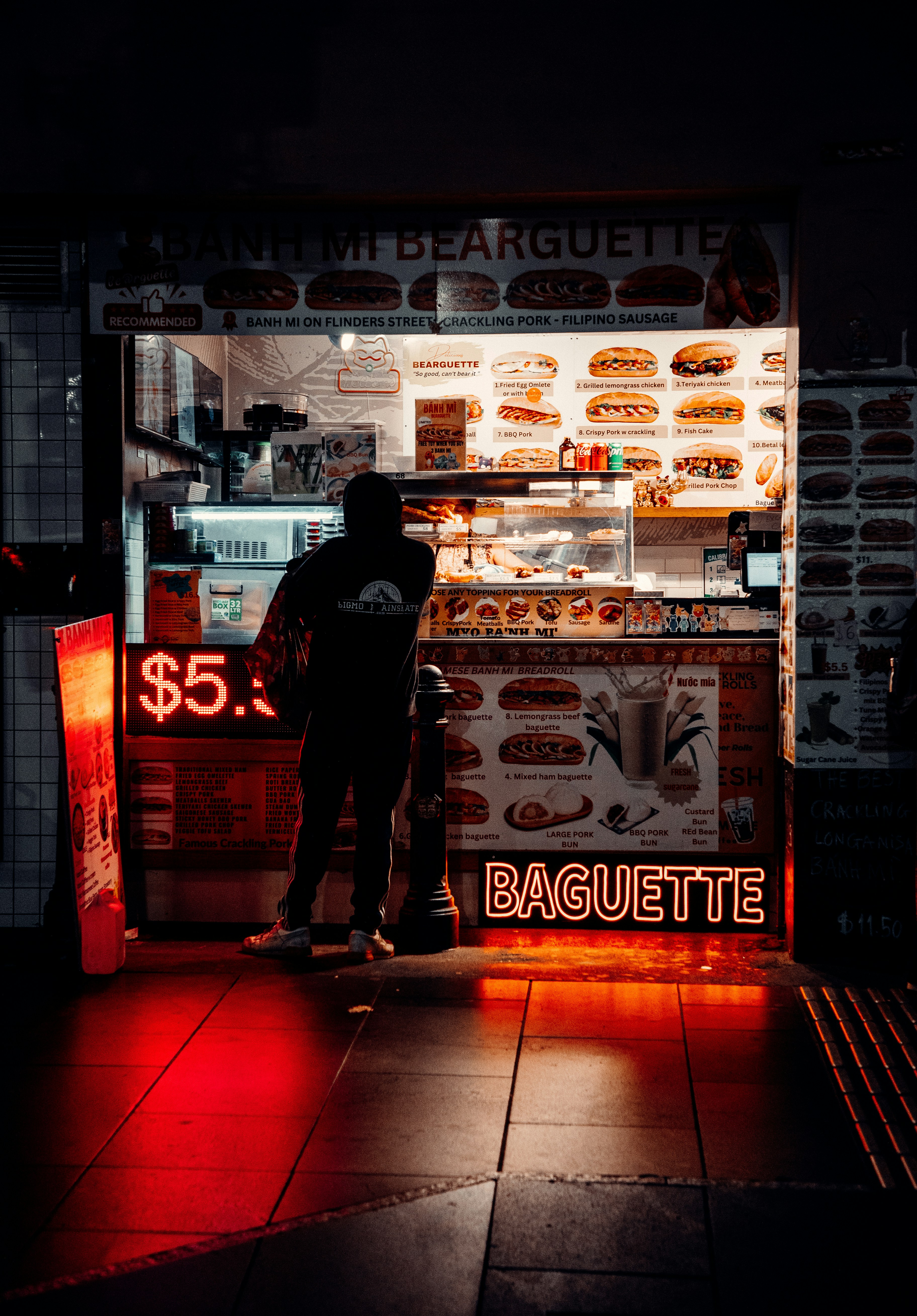 Neon Night at the Baguette Counter: Silhouette in Red Glow