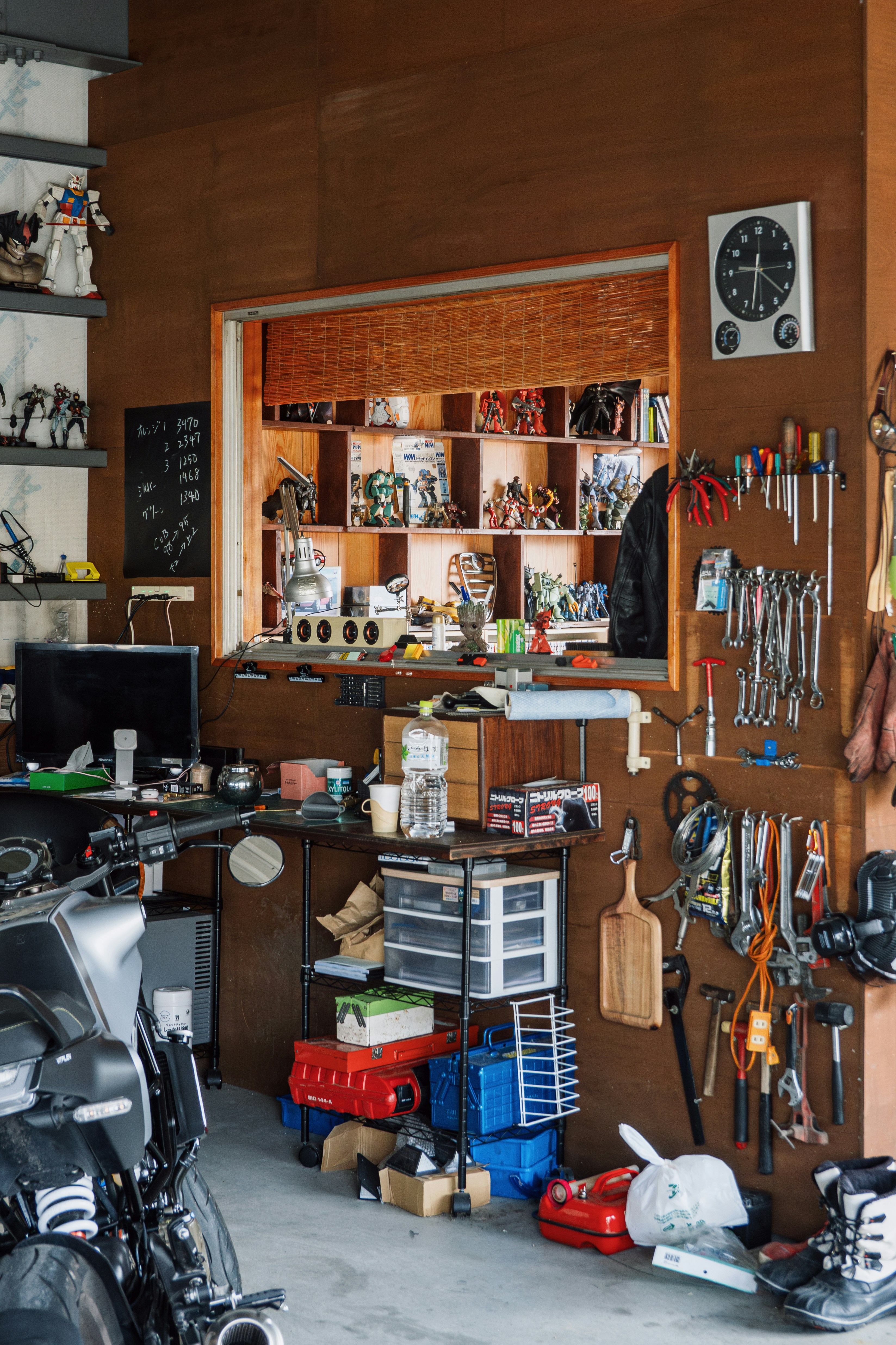 A cluttered garage displays tools, toys, and equipment. photo – Free ...