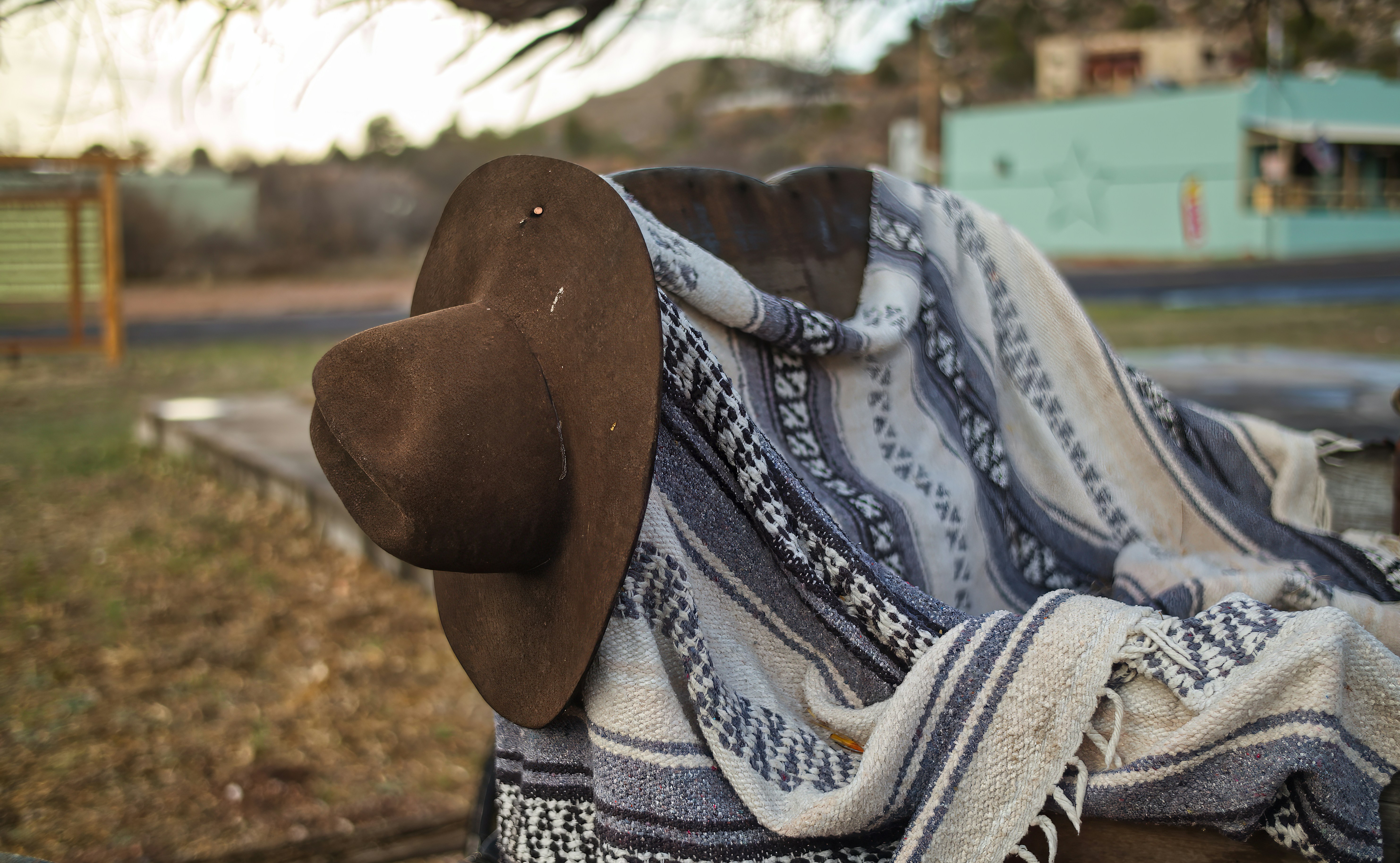 Cowboy hat and blanket rest on a rustic bench. photo – Free Usa Image ...