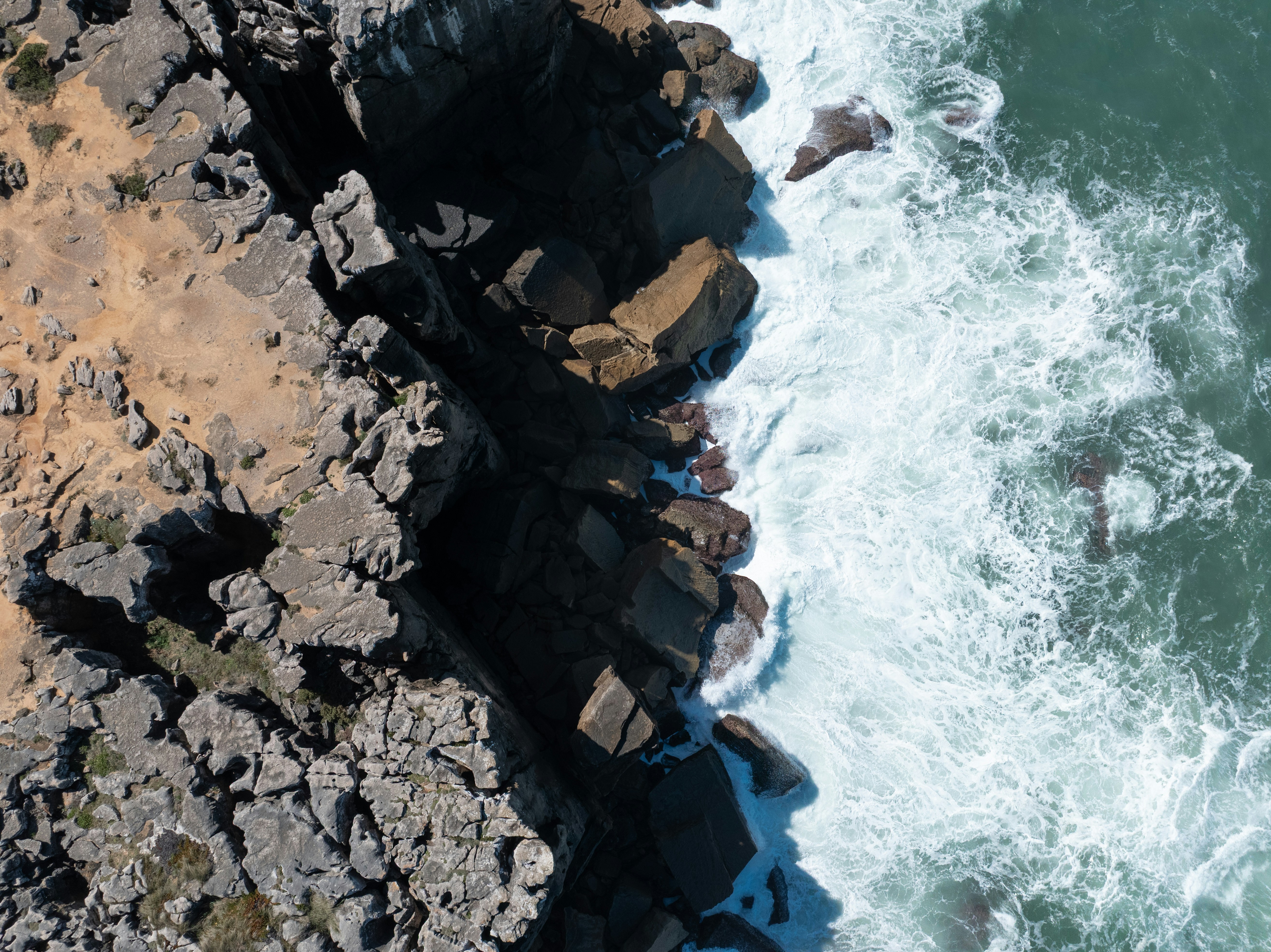 Cliffside Collision: Where Rocks Confront the Sea