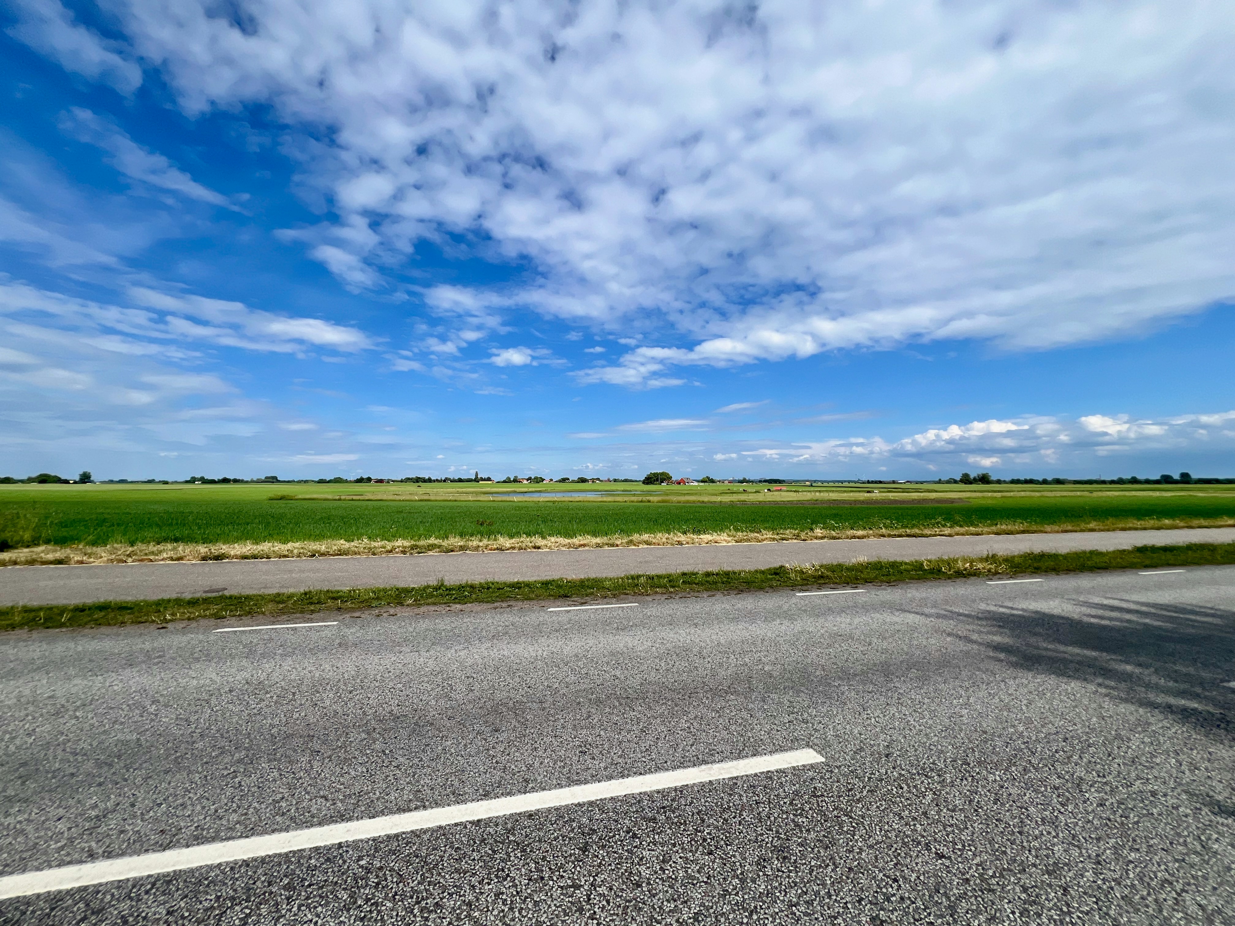 Horizon Line Over a Quiet Highway Through the Prairie