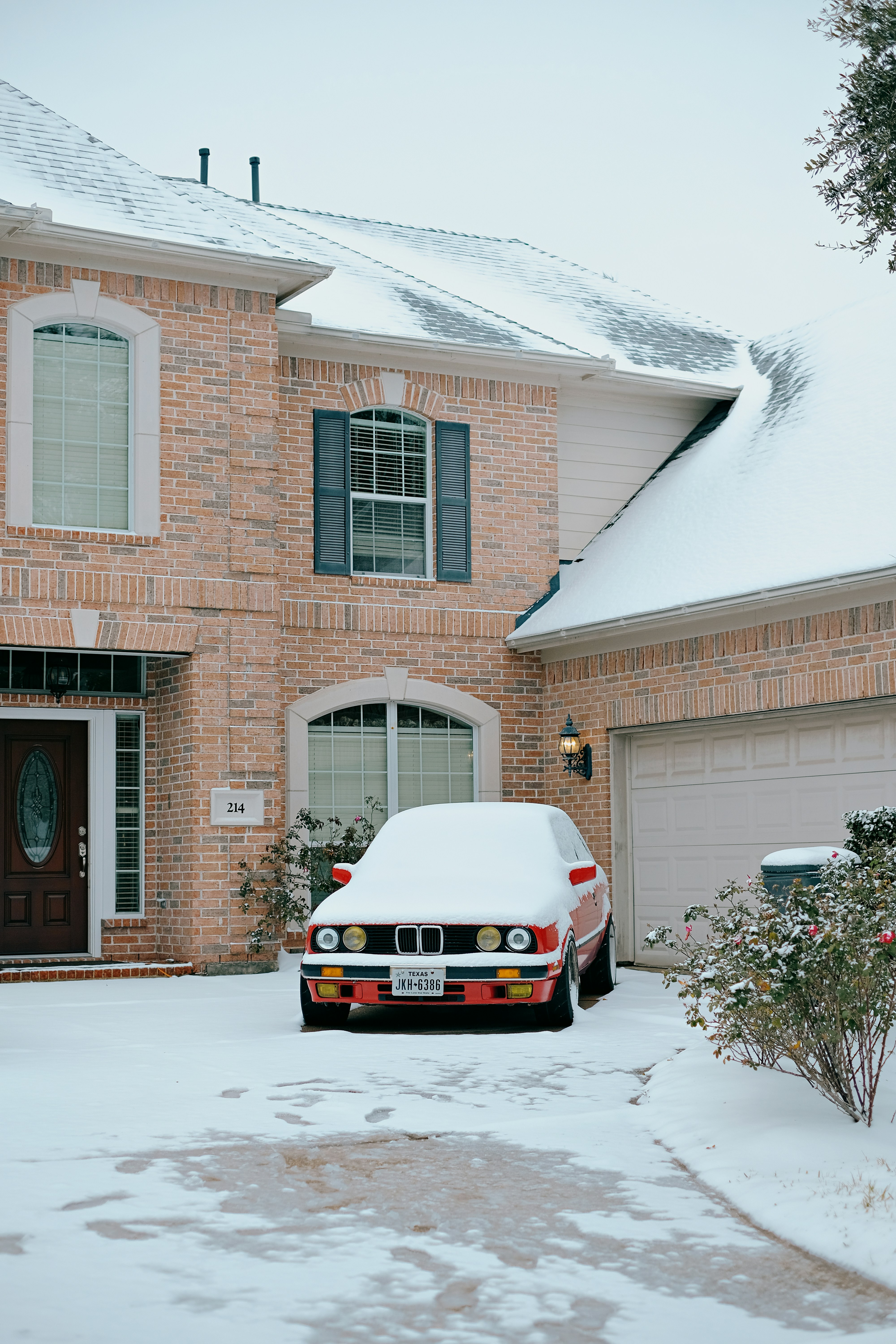 Winter's Embrace: A Classic Car Under Snow