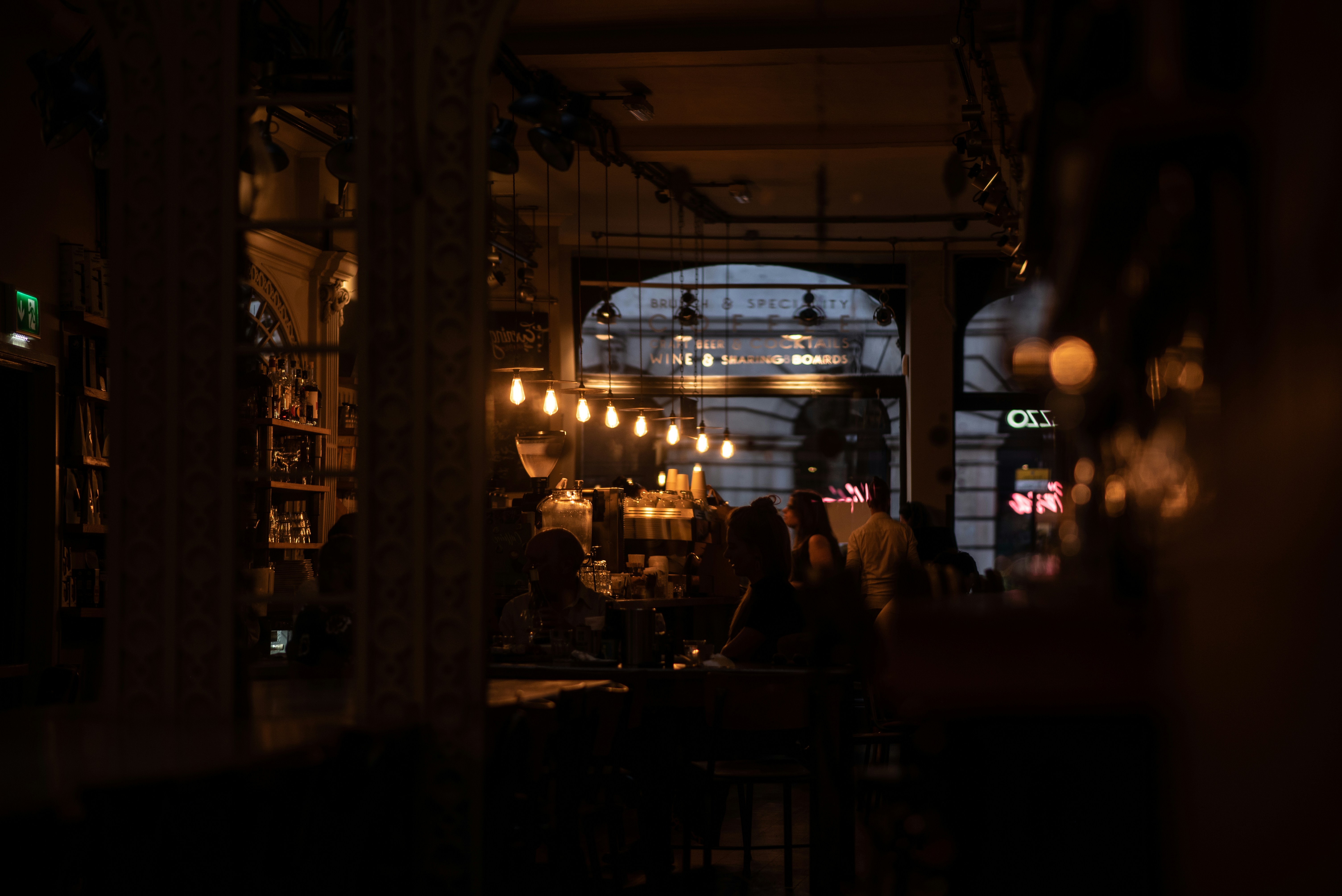 A dimly lit cafe scene at night. photo – Free Travel Image on Unsplash