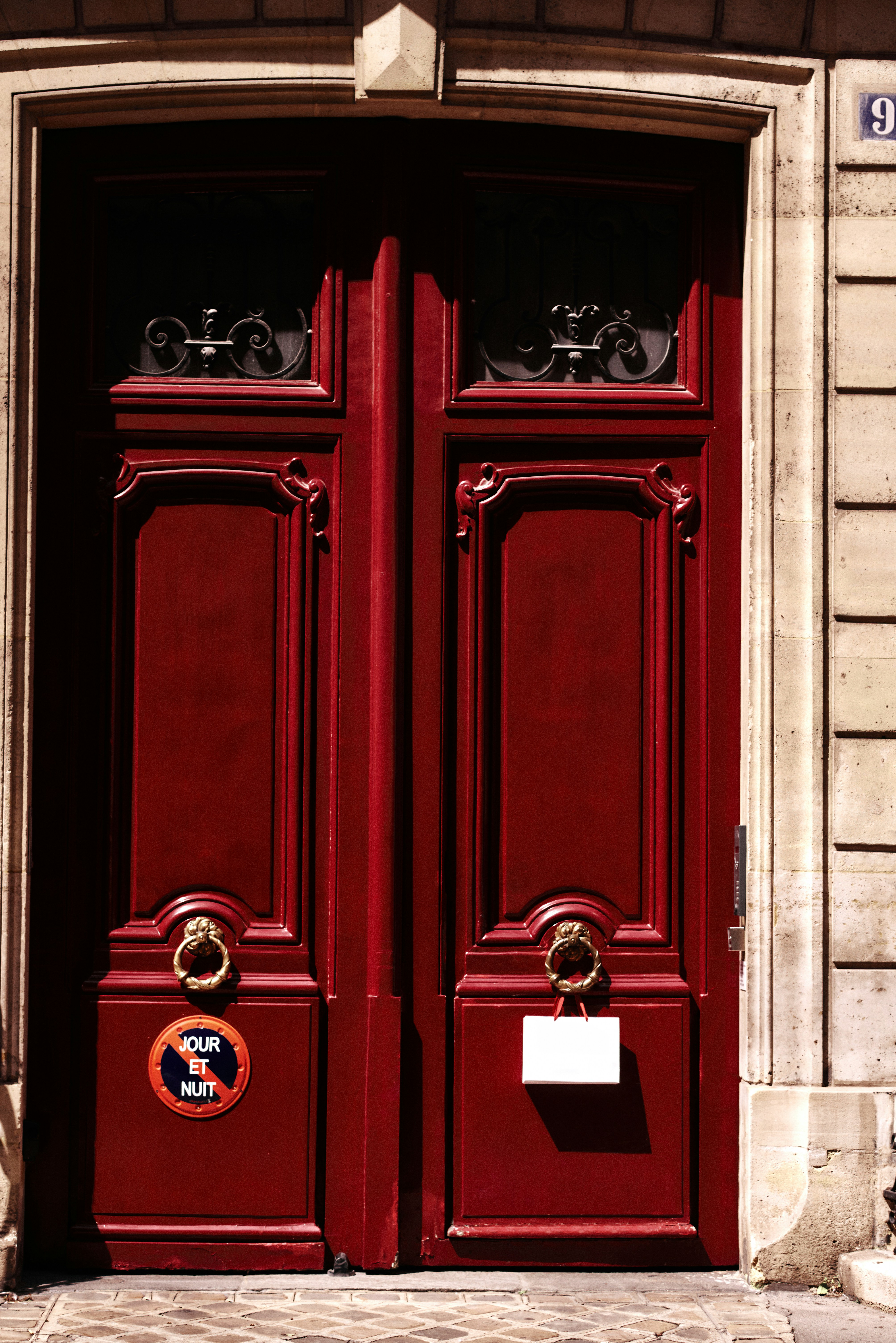 Crimson Doors of a Parisian Threshold