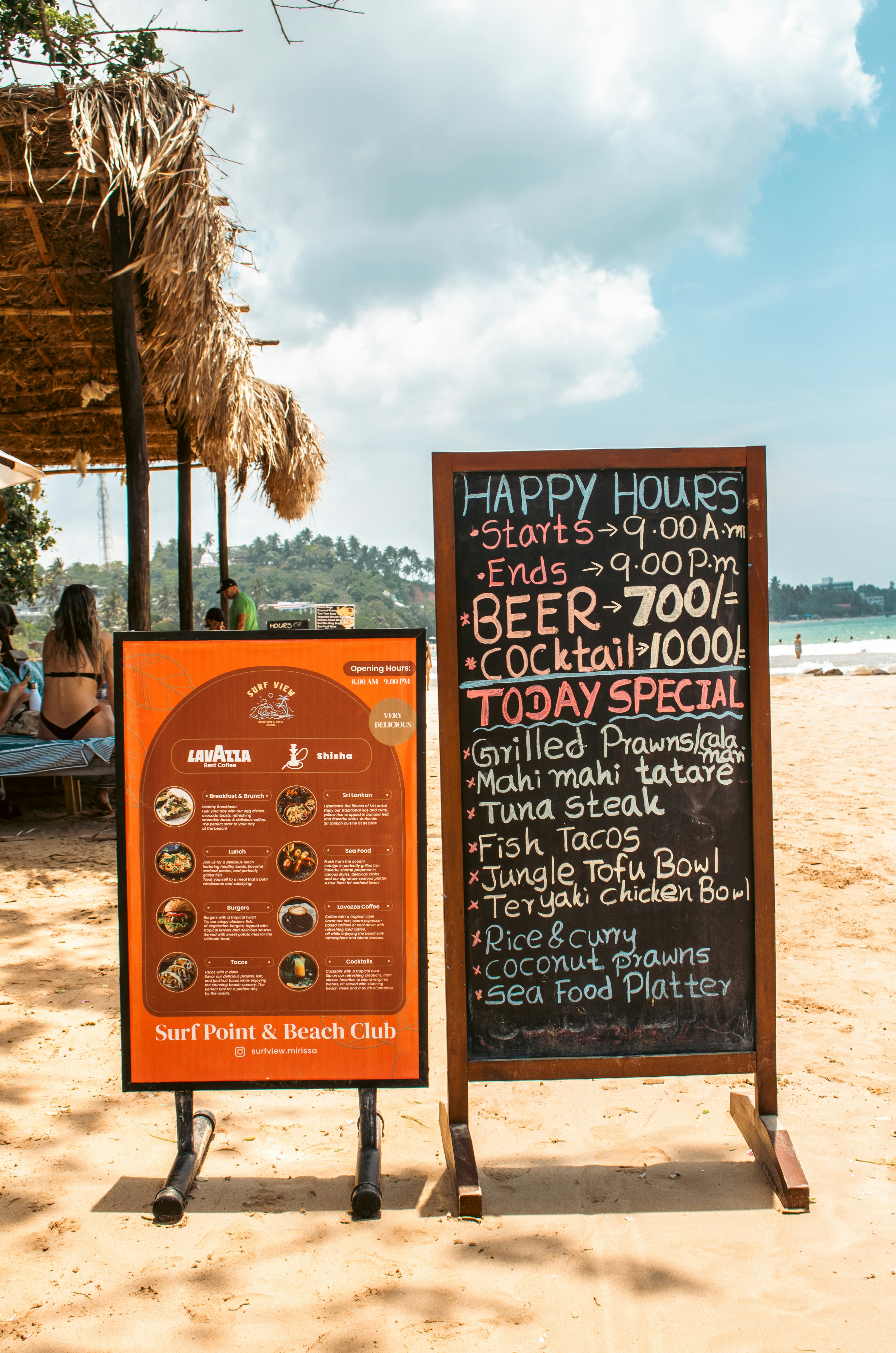 Beachfront restaurant signs advertise happy hour and menu. photo – Free ...