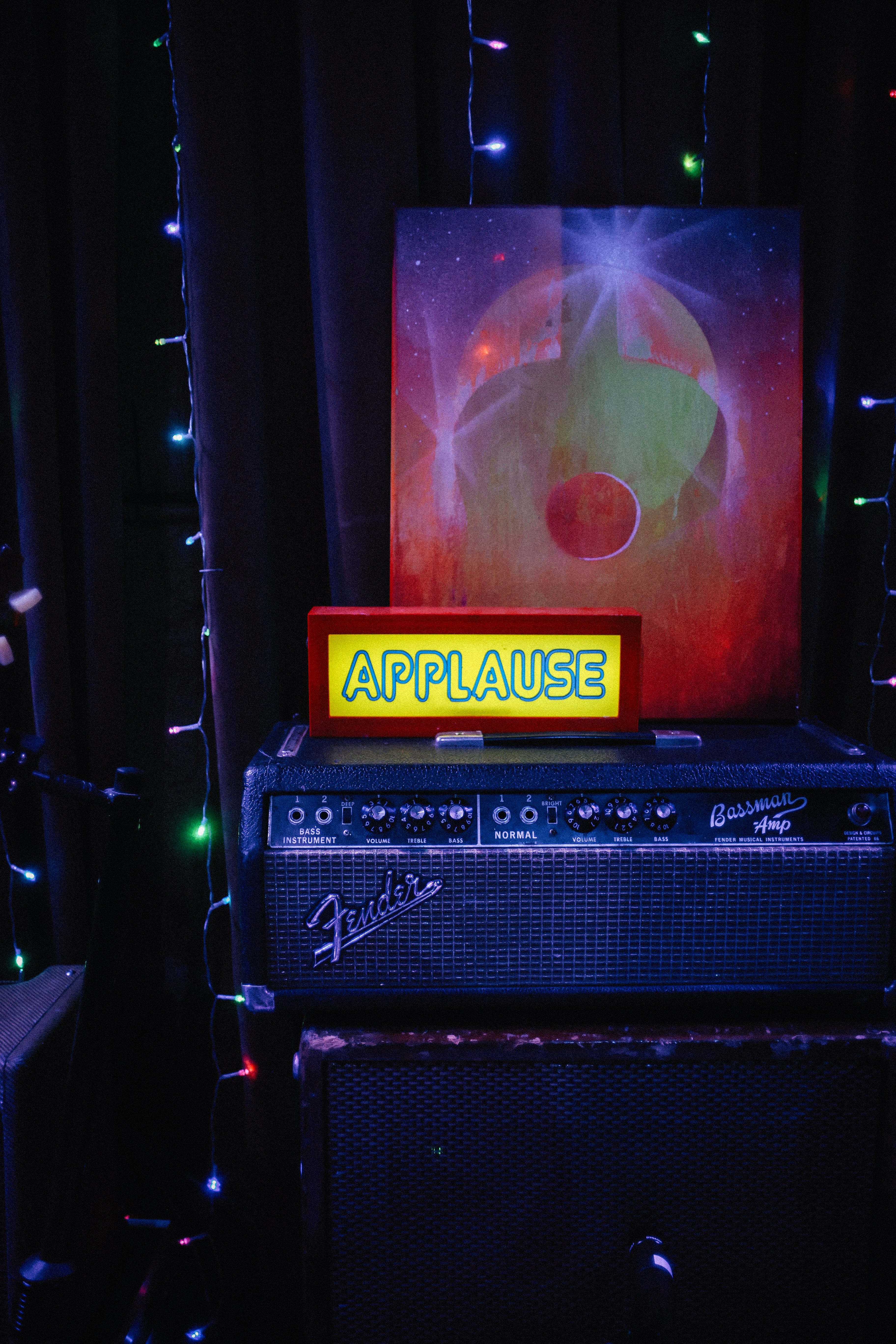 A fender amp and a lit "applause" sign. photo – Free Human Image on ...
