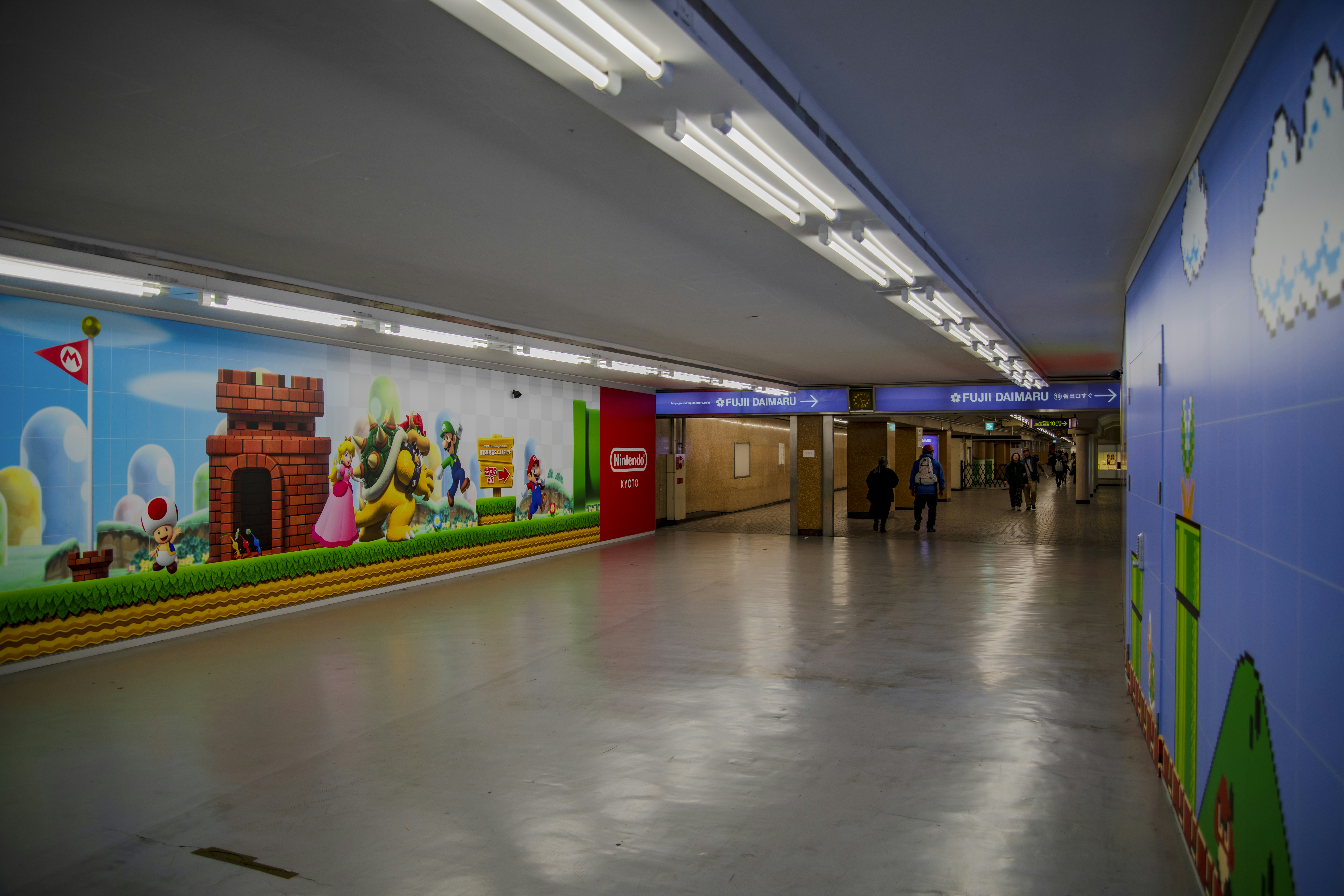 Colorful Toy-World Murals Illuminate a Quiet Subway Corridor