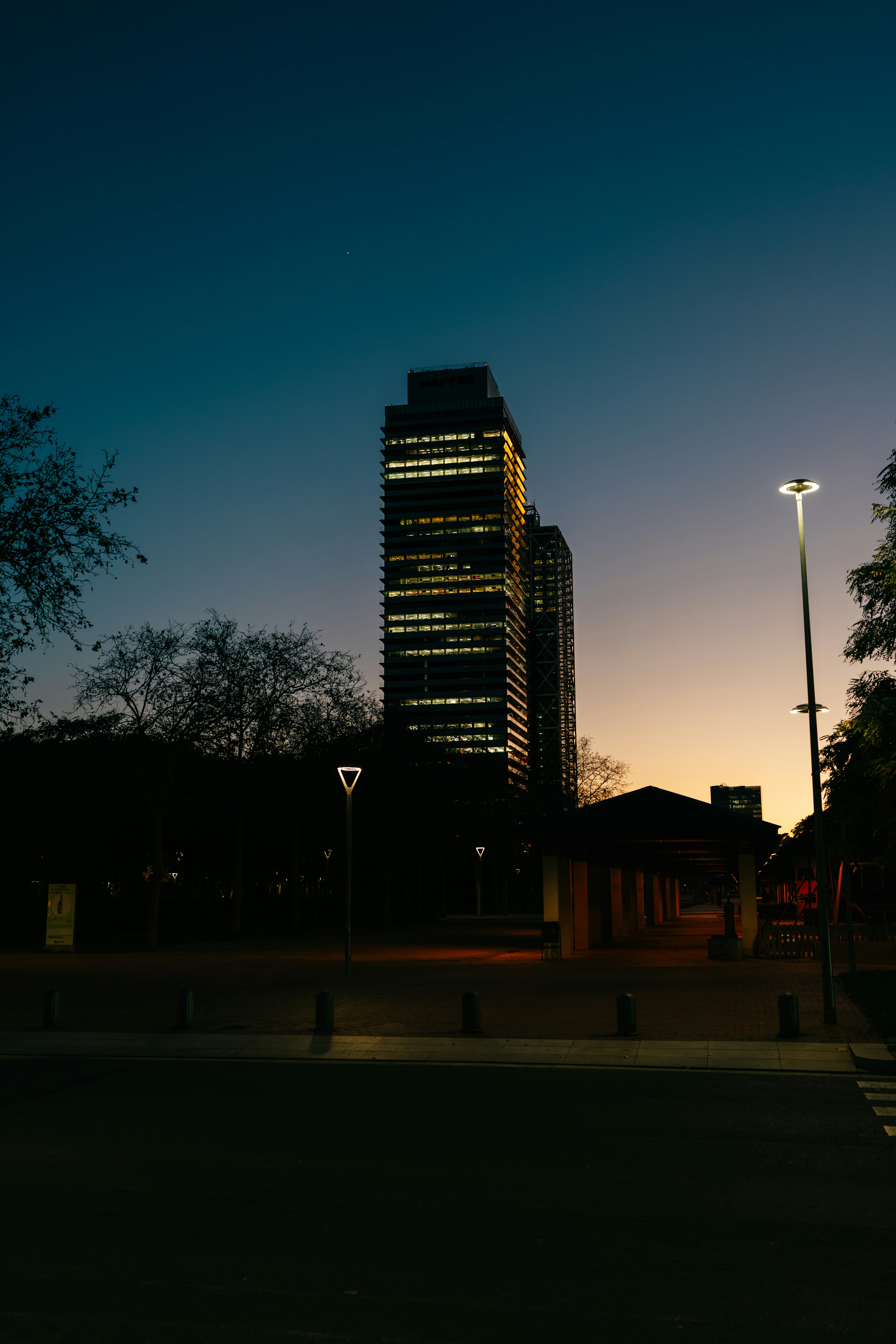 Skyscrapers light up the dusk sky. photo – Free Building Image on Unsplash
