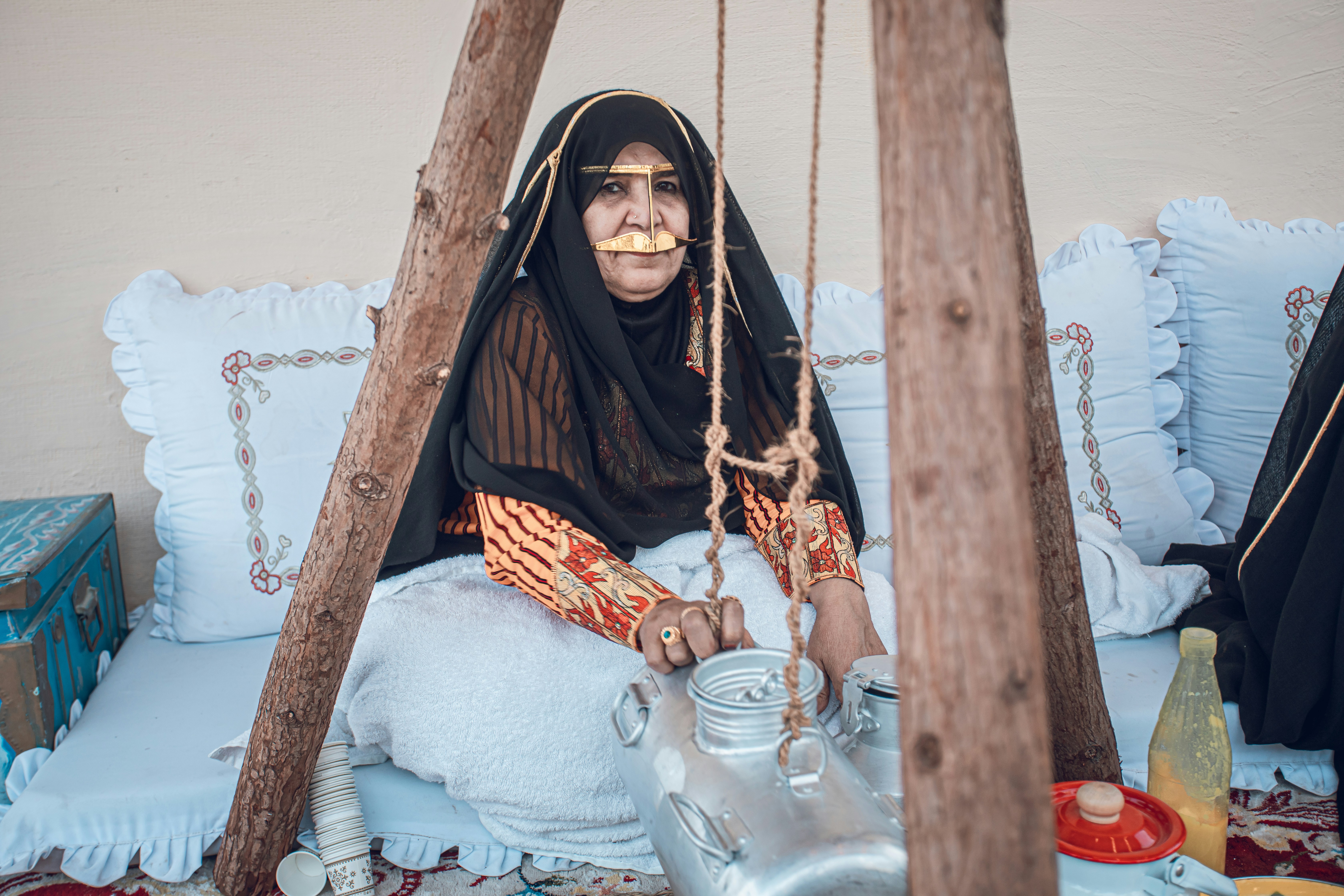 Veiled Portrait by the Wooden Swing: Tradition, Texture, and Quiet Hospitality