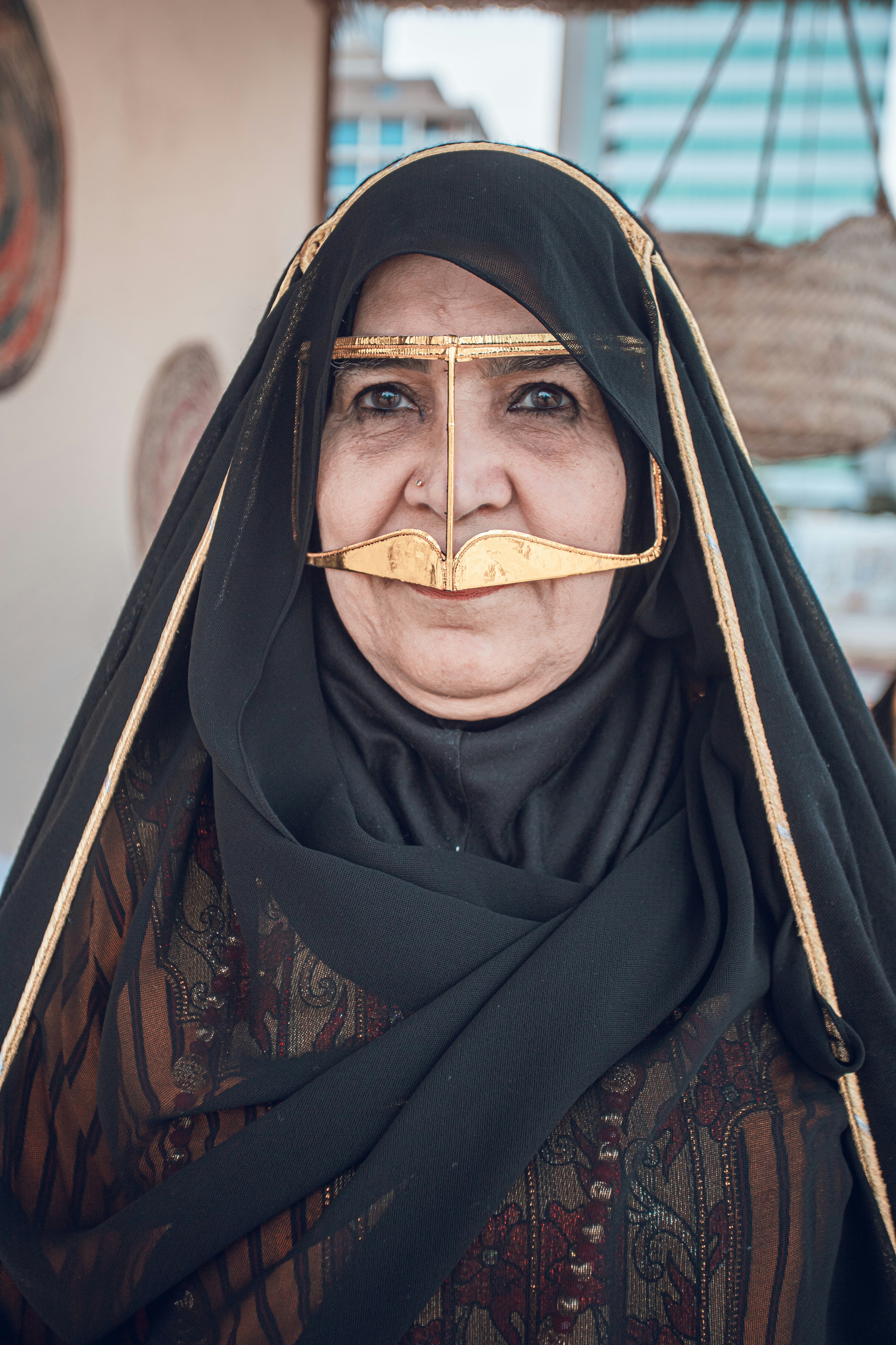 An older woman wears traditional middle eastern clothing. photo – Free ...