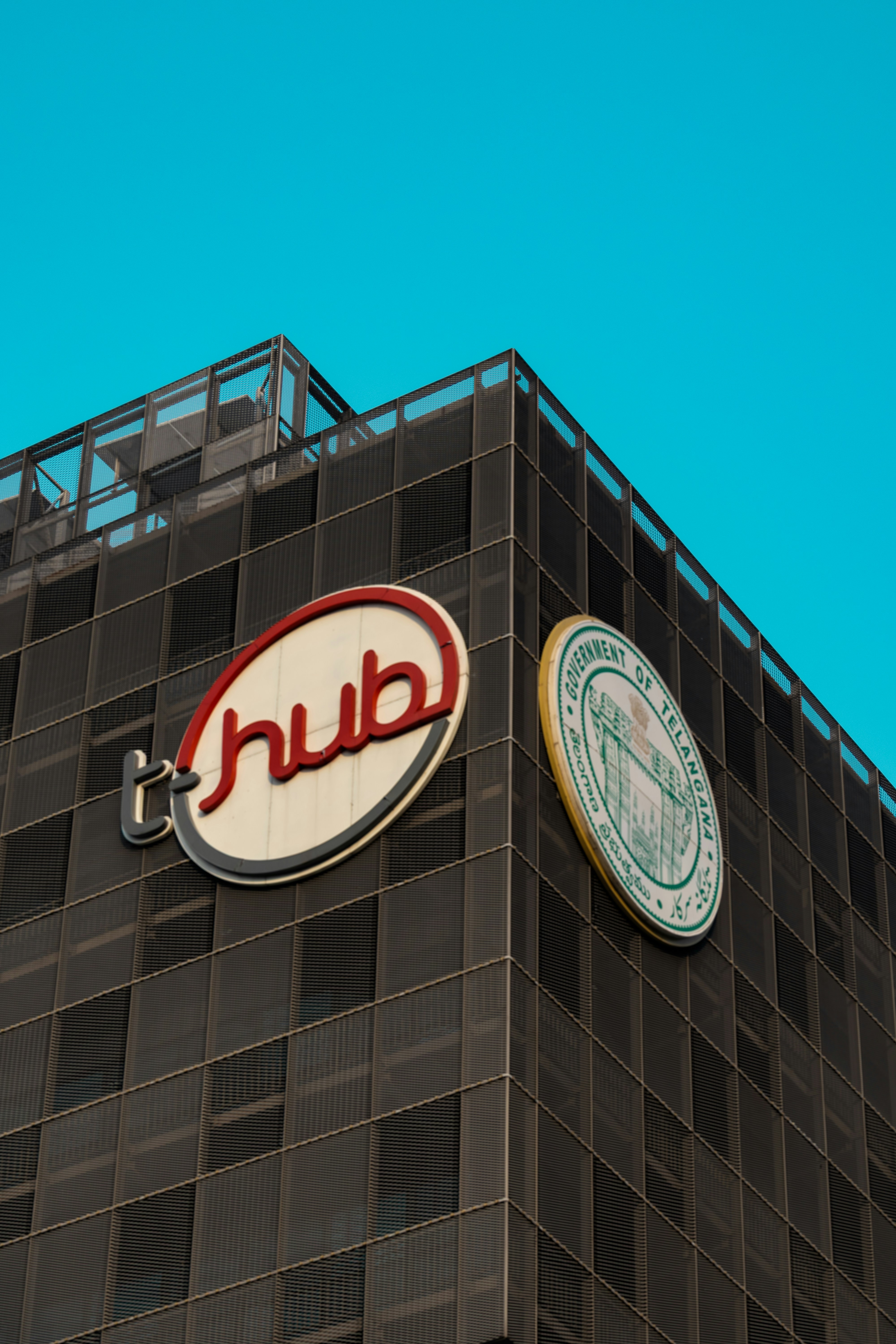 The hub building with two business signs. photo – Free Building Image ...