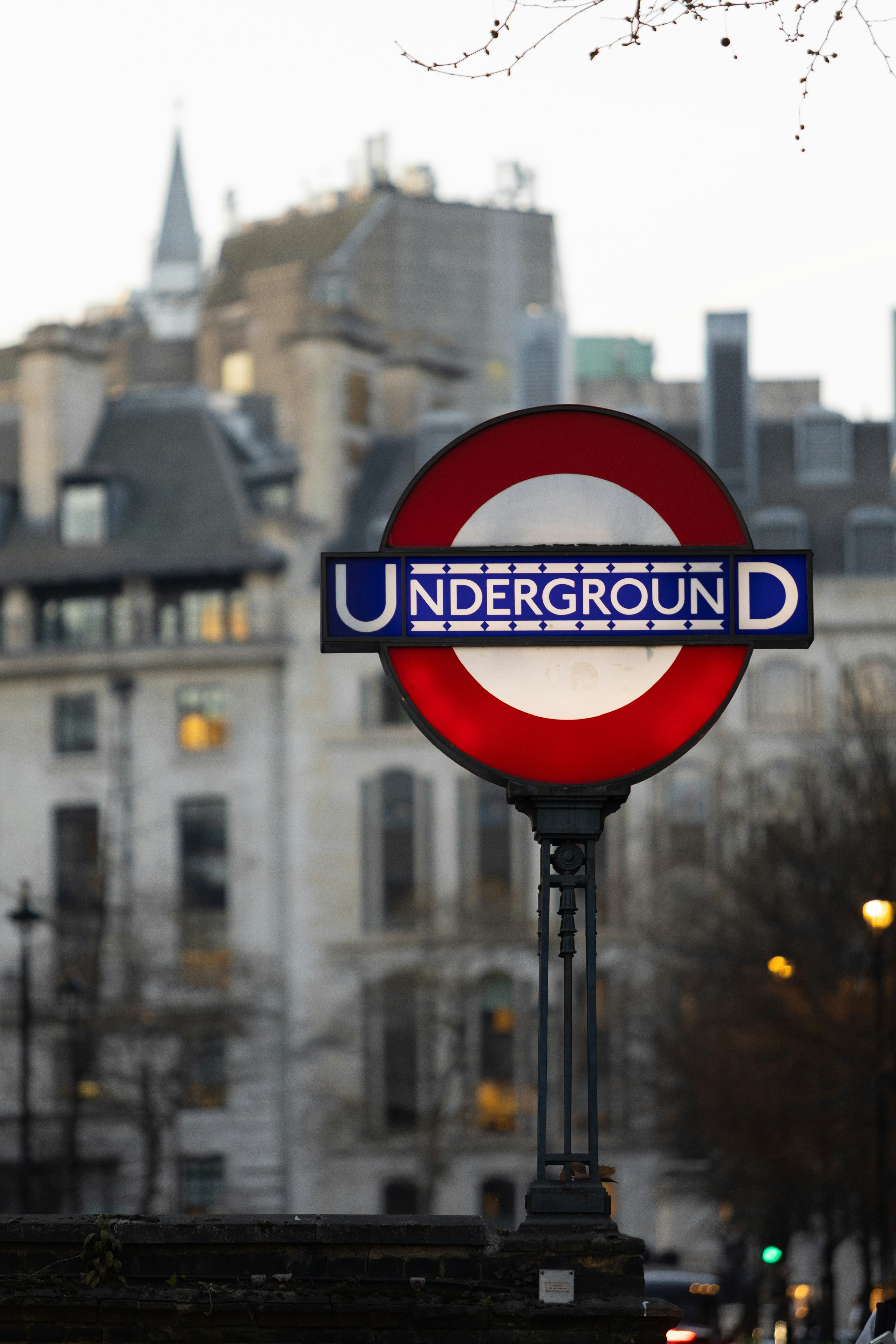 Underground Emblem Against a City Backdrop