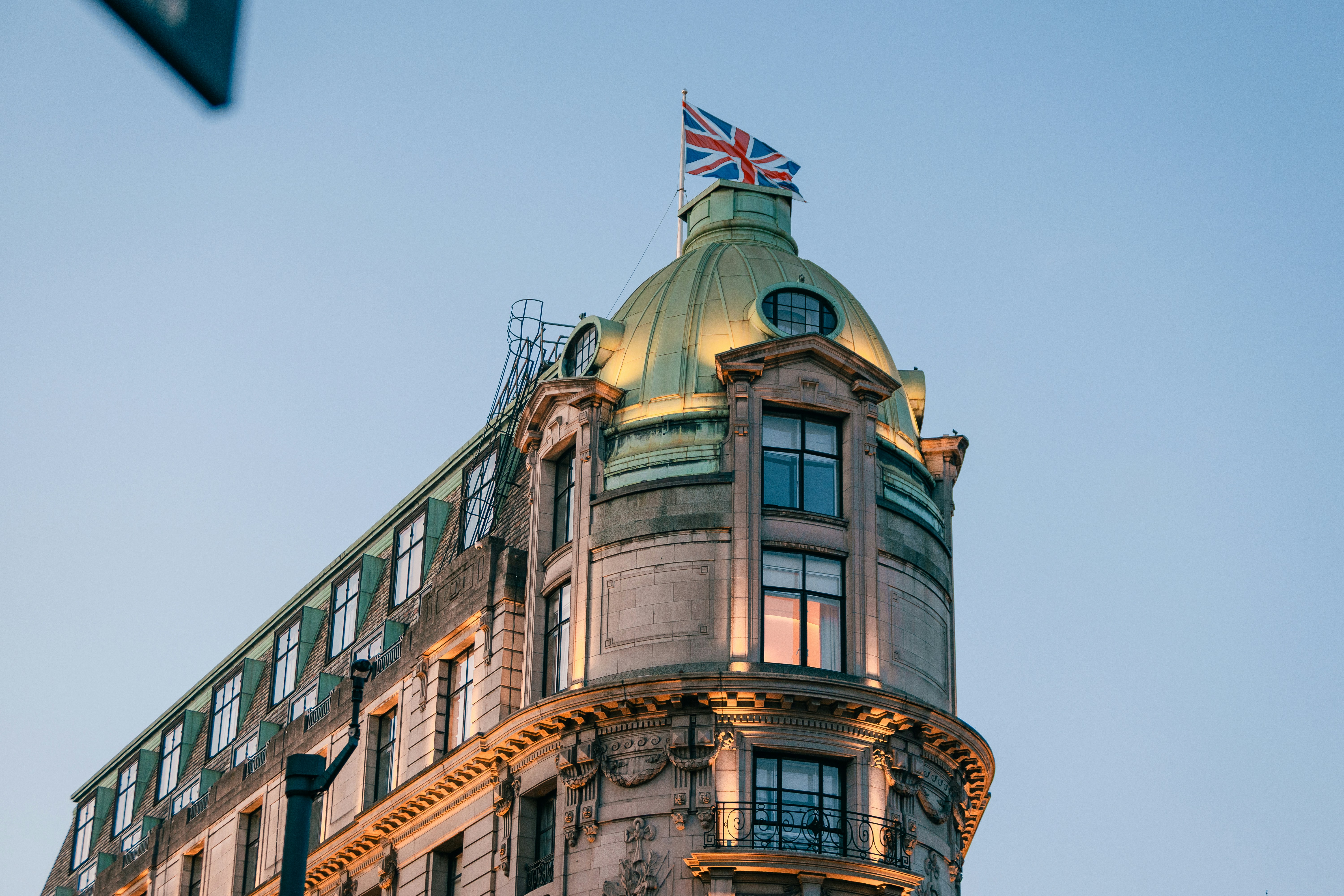 A building displays the union jack flag. photo – Free City Image on ...