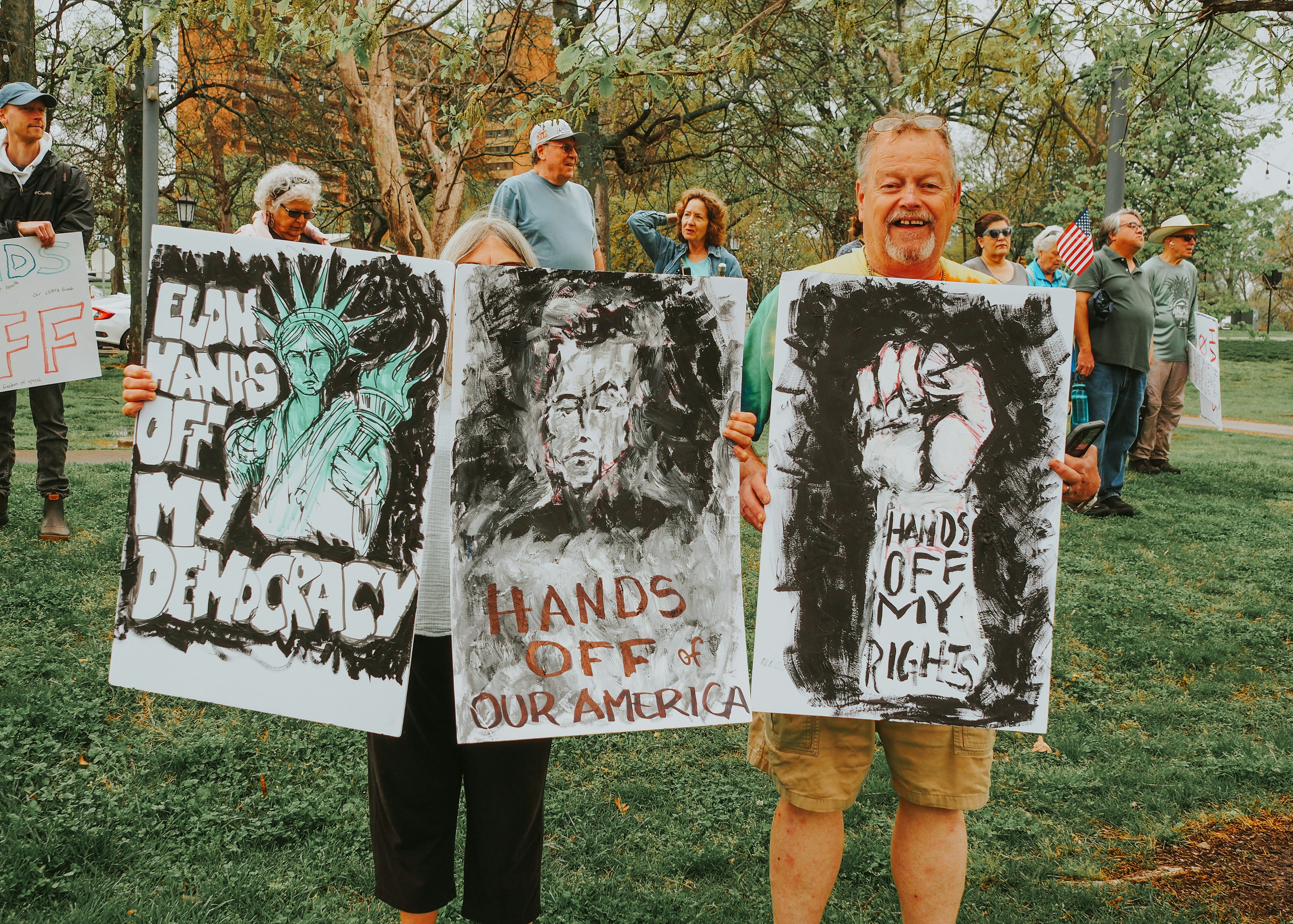 People protest with signs advocating for democracy. photo – Free Forest ...
