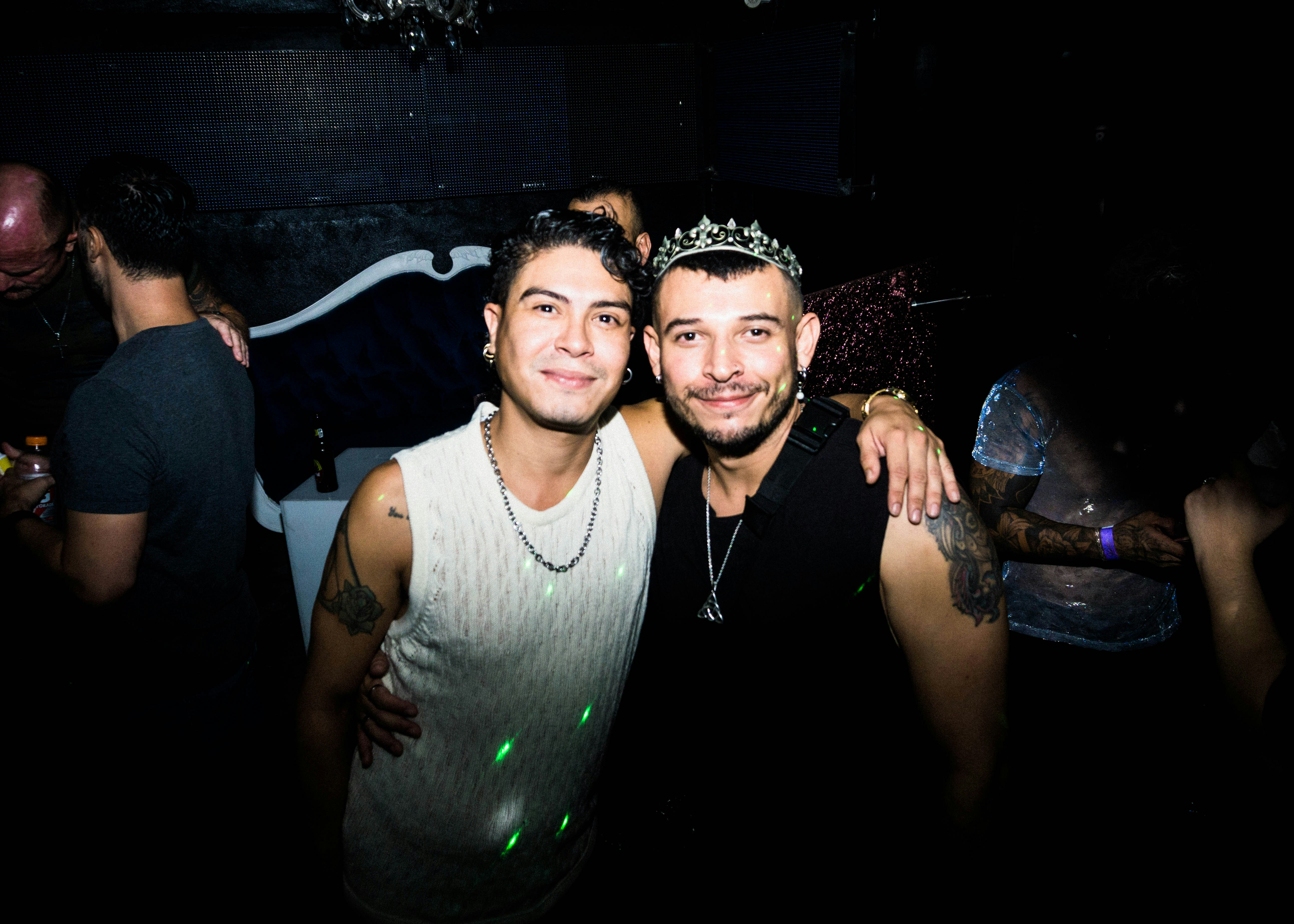Two men are smiling at a night club. photo – Free Portrait Image on ...