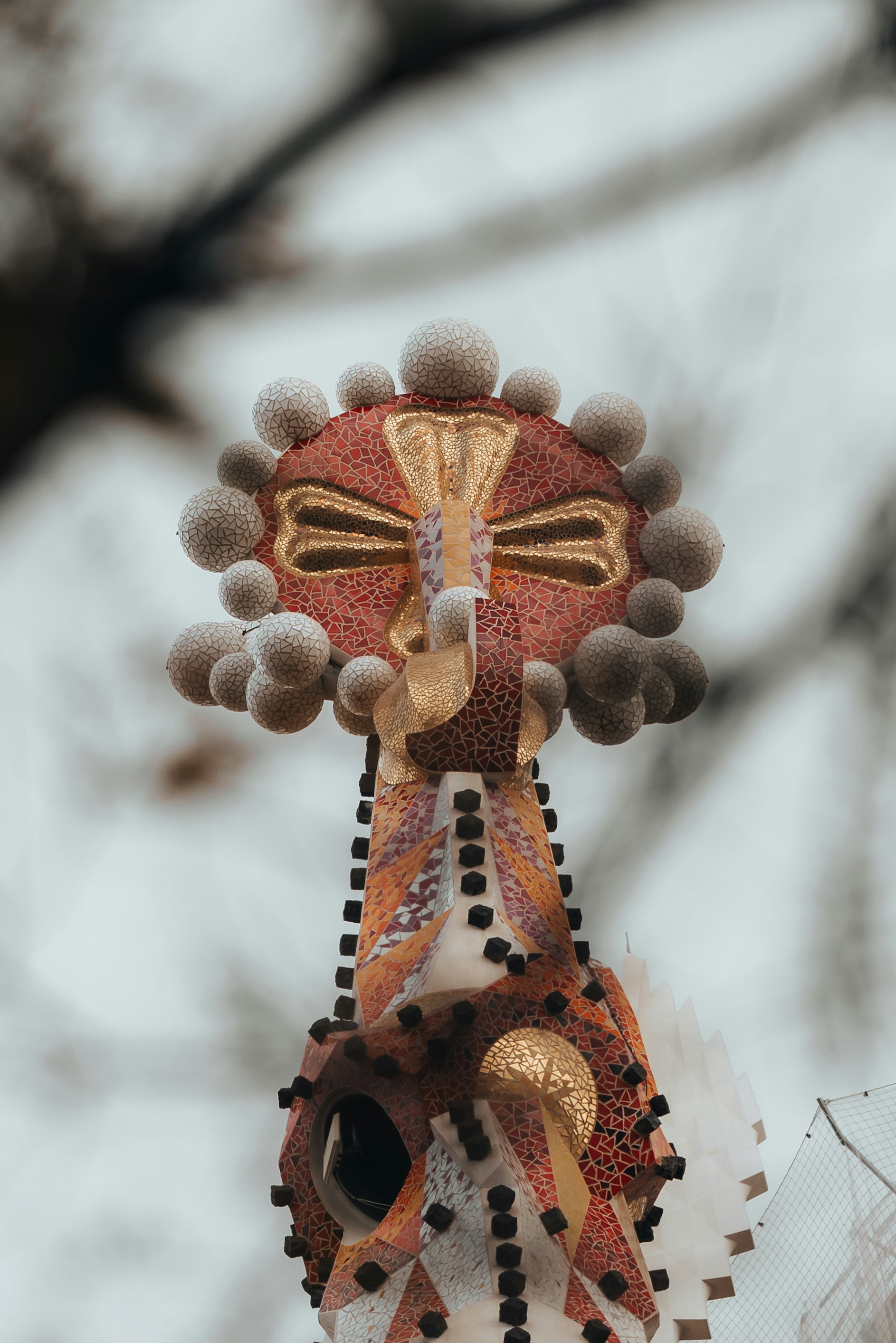 Crimson Mosaic Crown with Beaded Orbs Over a Studded Mask