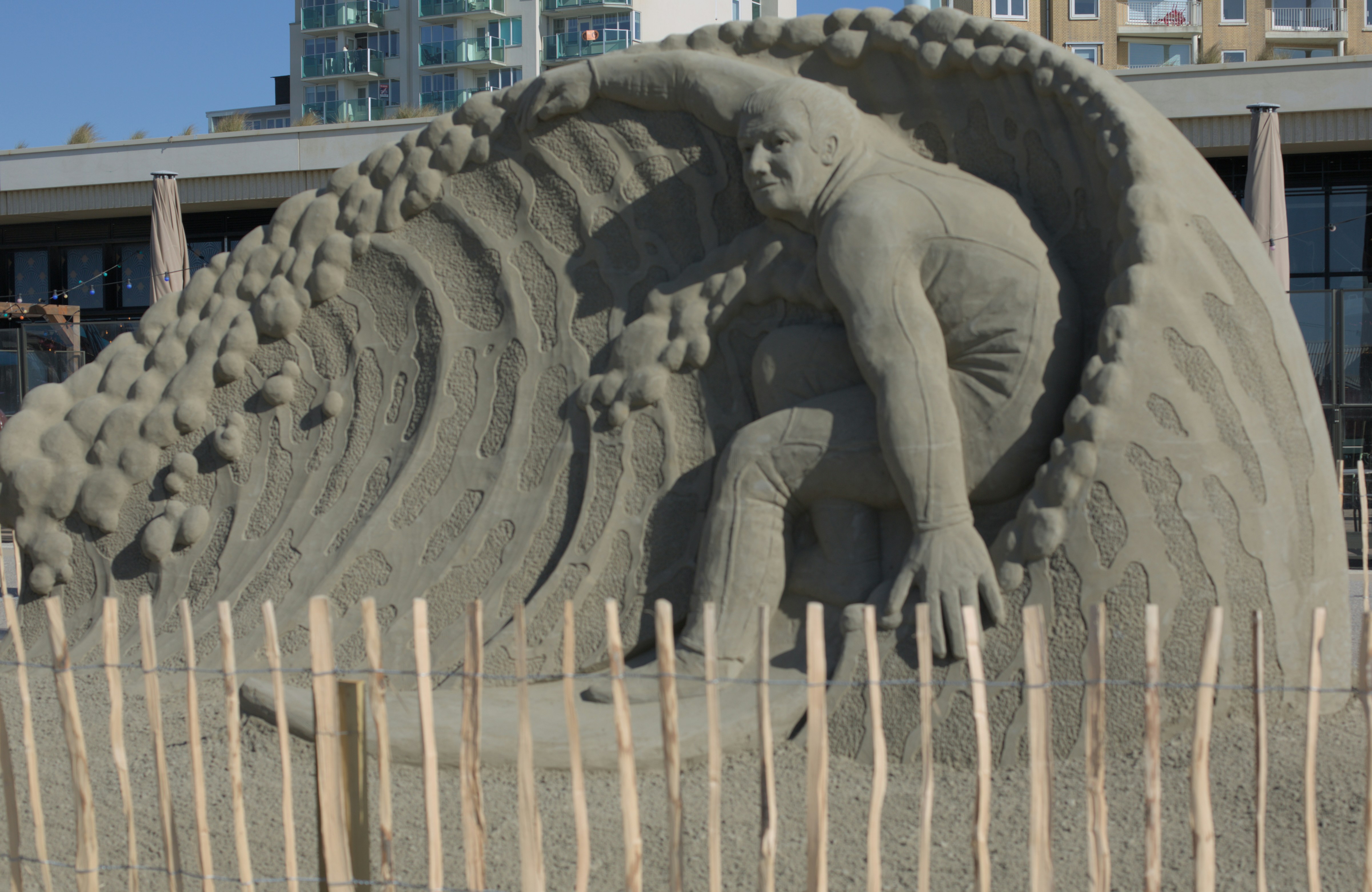 Epic Wave: Sand Sculpture of a Surfer