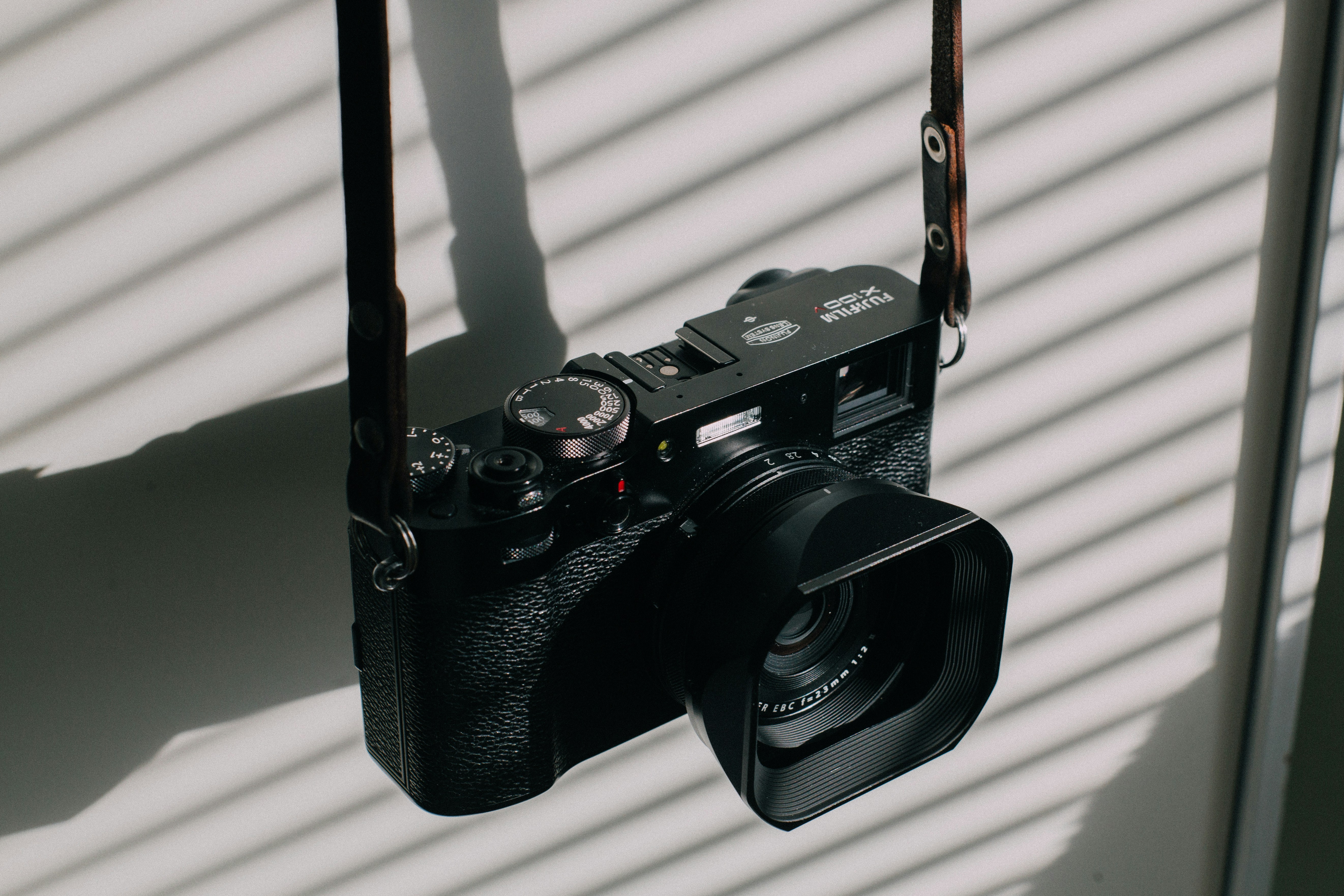 Striped Light, Timeless Lens: A Vintage Rangefinder in Shadow