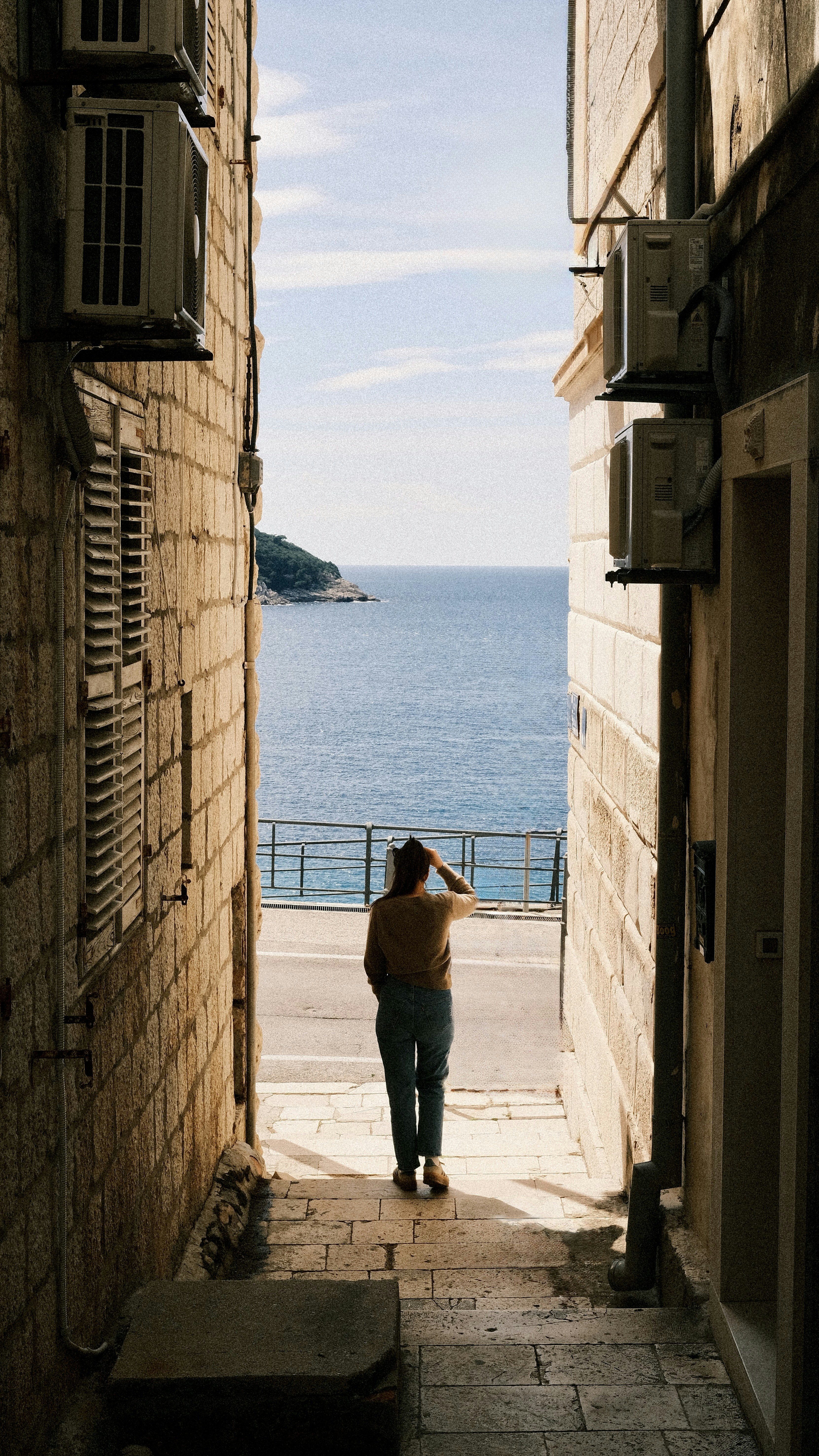 Seaside Glimpse Through Narrow Passage