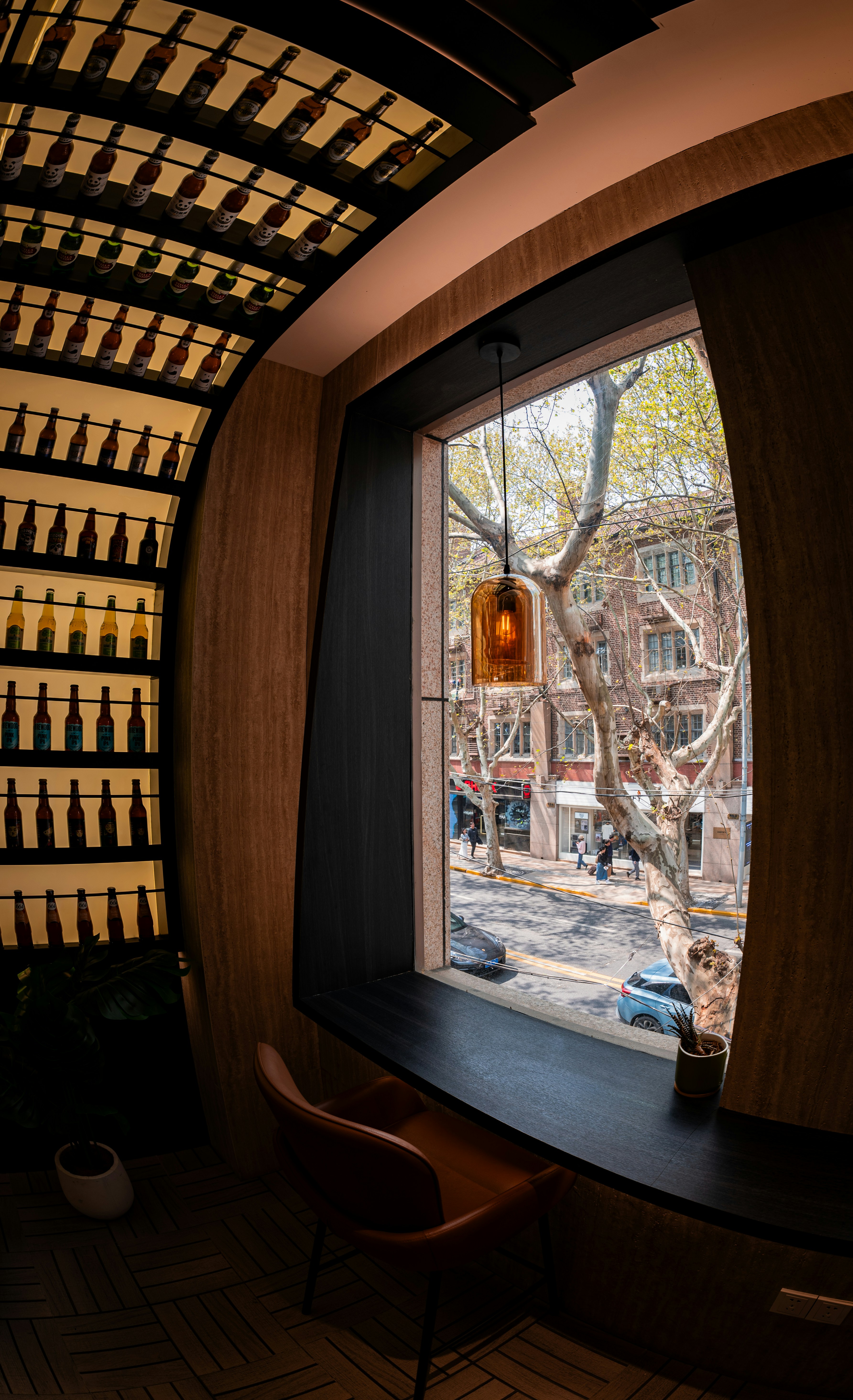 Amber Pendant Over the Café Window: Street Scene Framed by Warm Interior