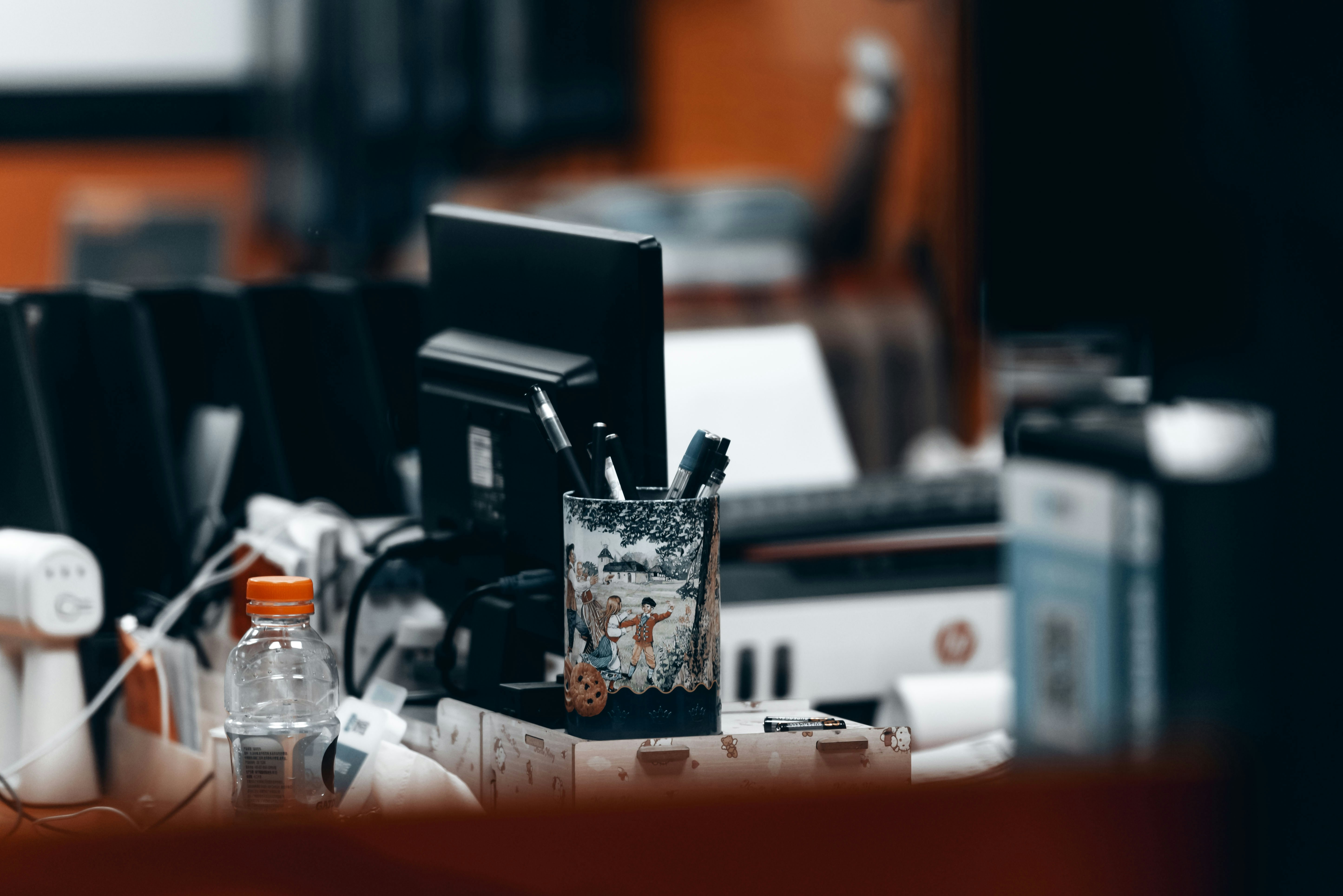 A cluttered desk with a computer and supplies. photo – Free Coffee ...