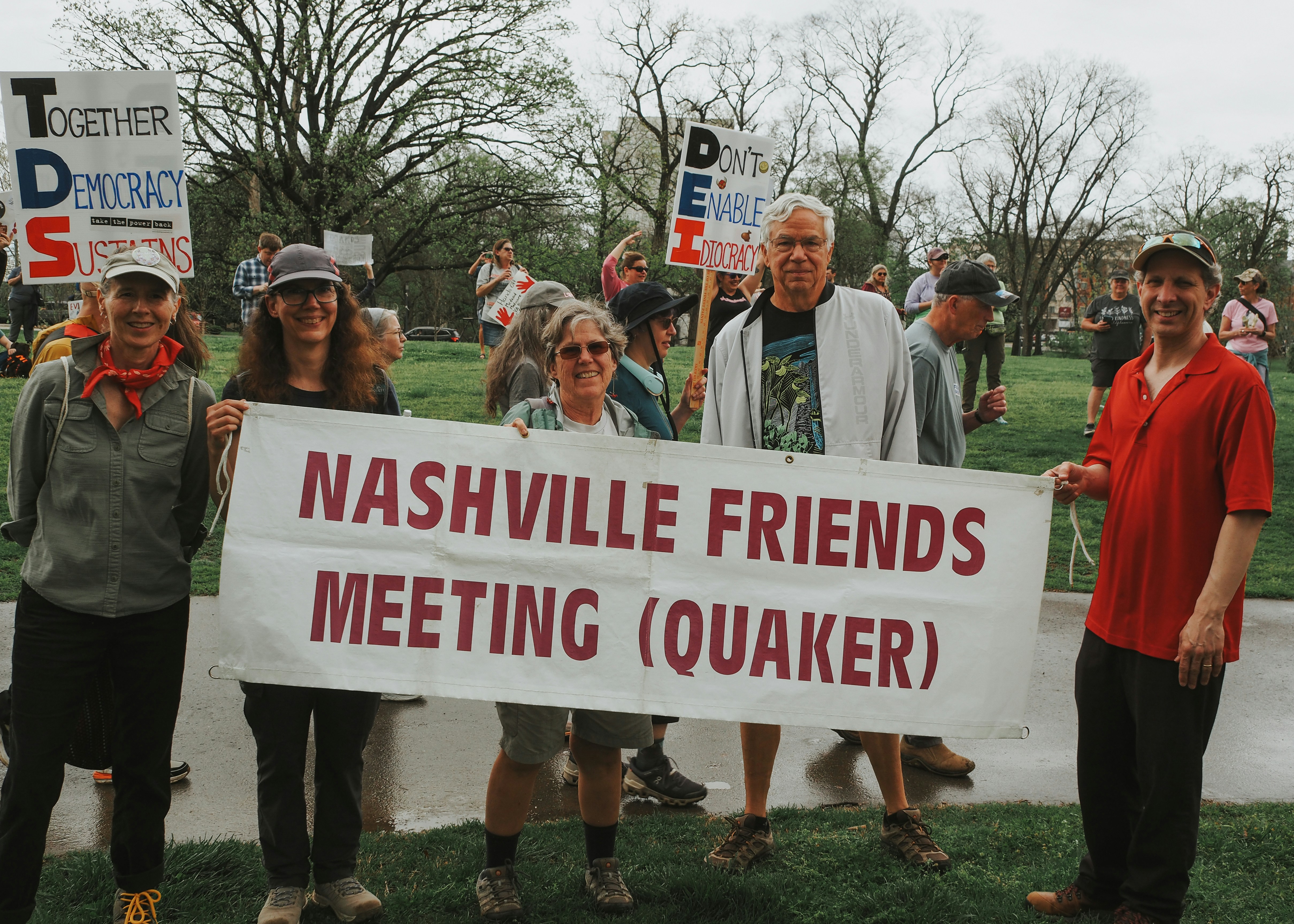 People hold a banner at a quaker meeting protest. photo – Free Car ...